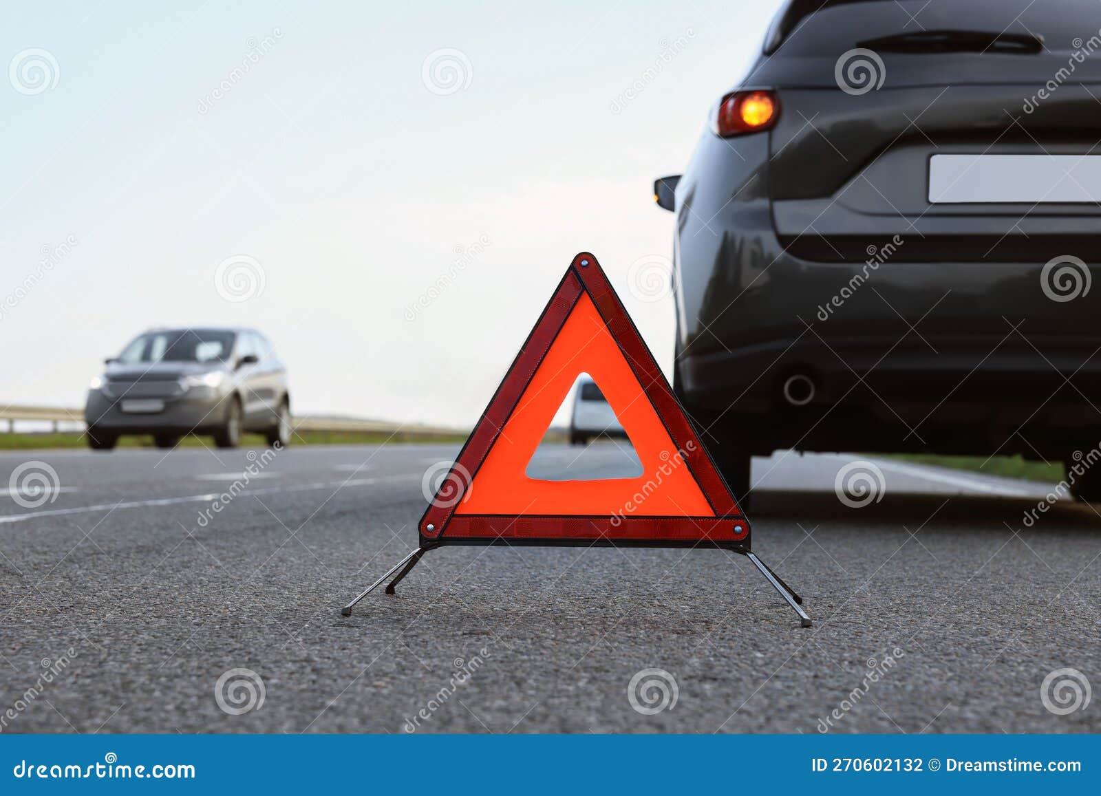 Emergency Warning Triangle Near Car on Roadside. Tire Puncture Stock ...
