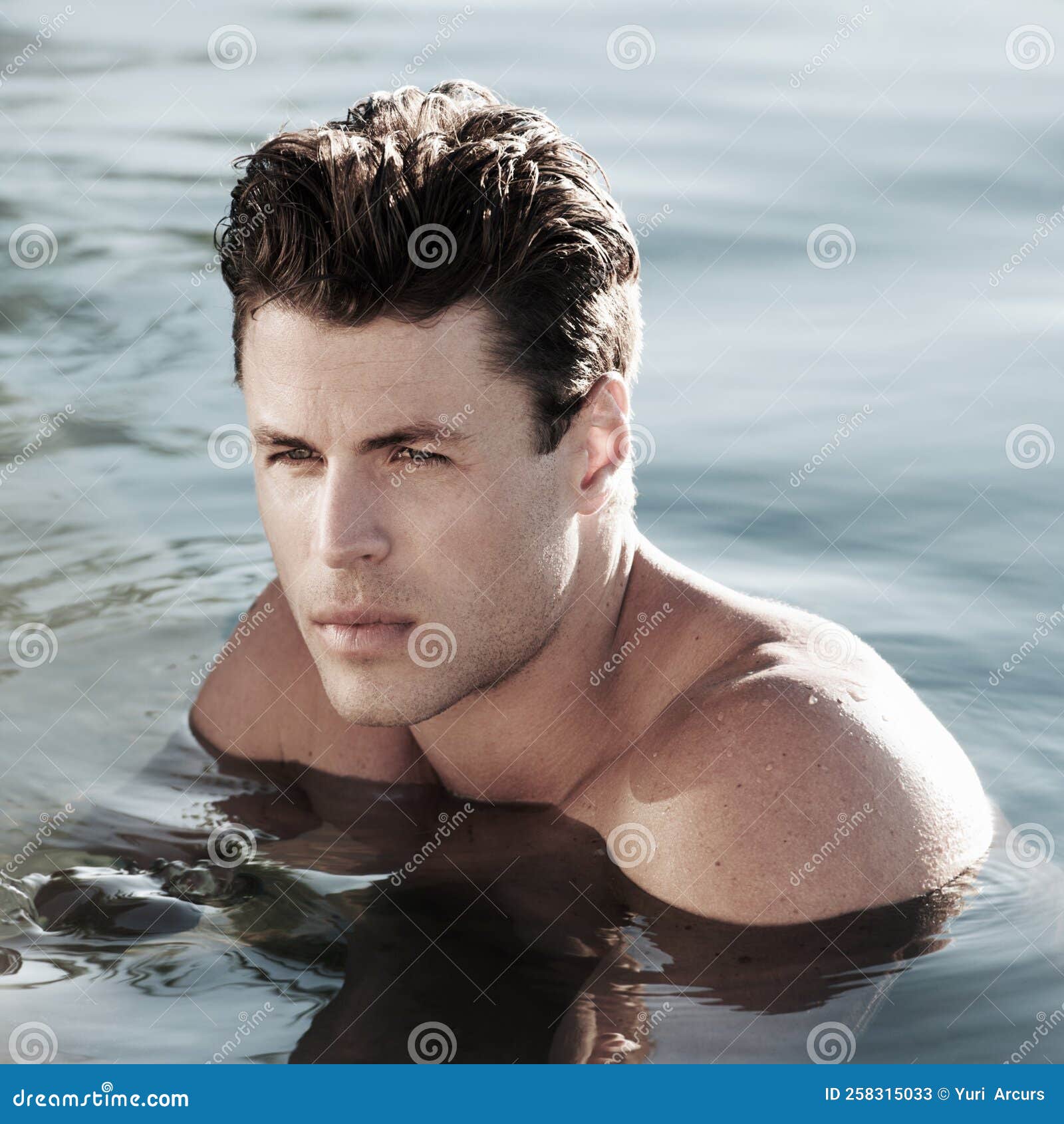 Emerging from the Water. a Handsome Man Looking Contemplative Sitting ...