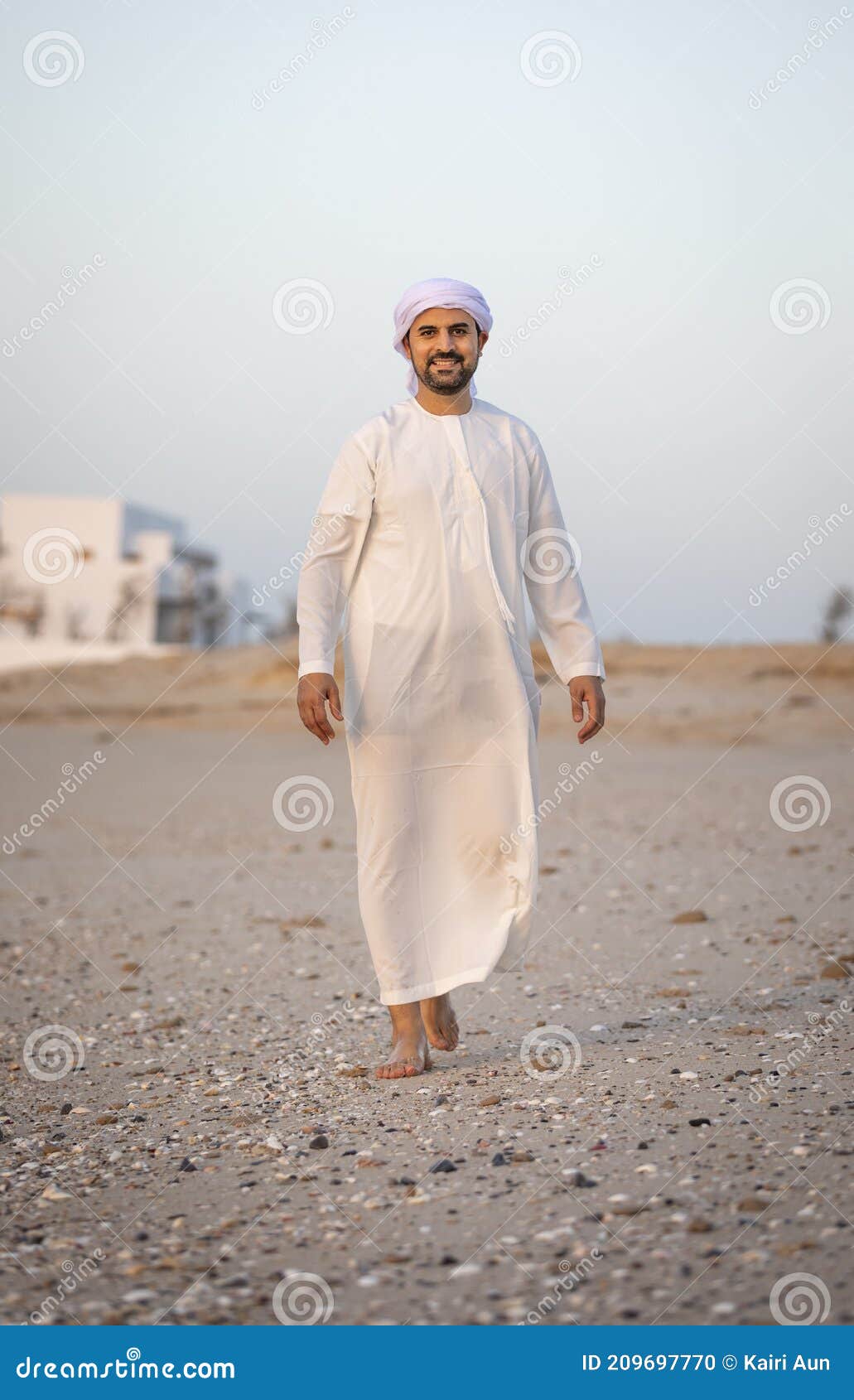 Emirati man on the beach stock photo. Image of sharjah - 209697770