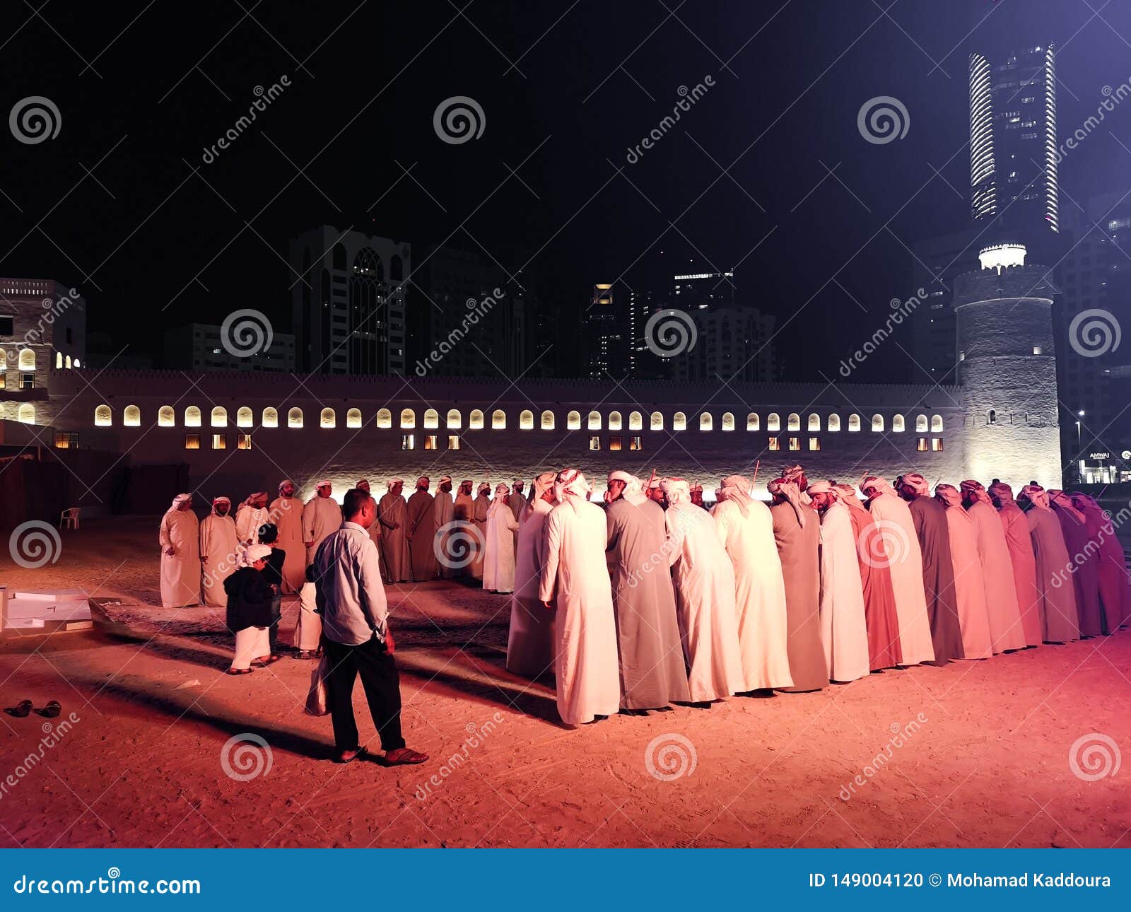 Emirati Men Perform a Tradional Middle Eastern Dance the Yowla ...