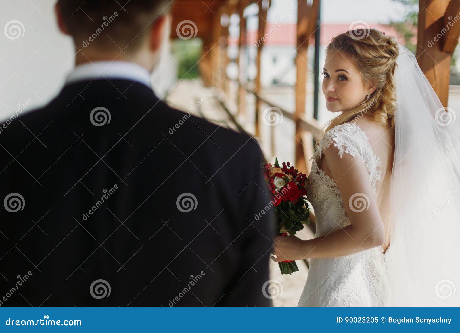 Emotional Blonde Bride Smiling And Looking At Groom Elegant Bride Stock