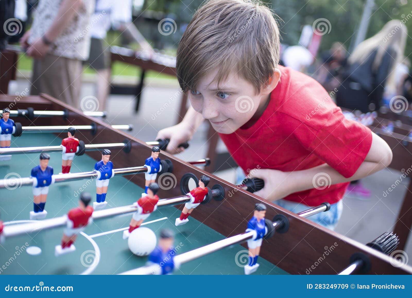 Boy Playing Table Football Outside Stock Image - Image of little ...