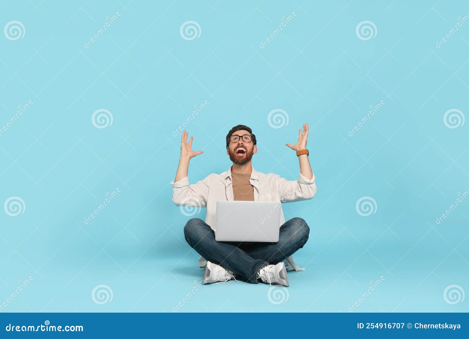 Man with Laptop on Light Blue Background Stock Image - Image of ...