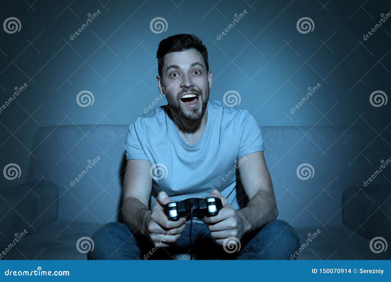 Emotional Man Playing Video Game in Evening Stock Photo - Image of ...