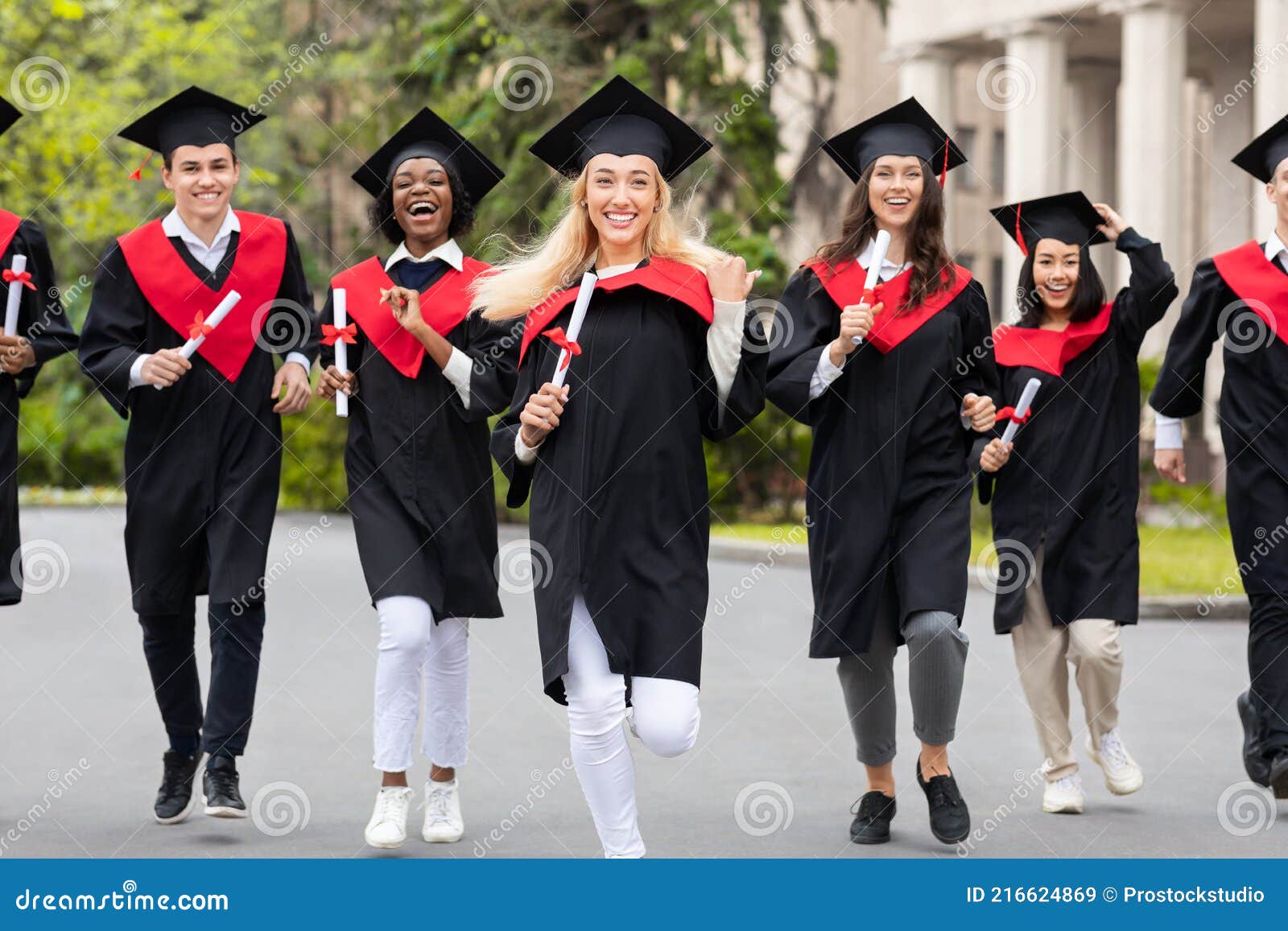 Emotional Multiracial Group of Students Running by University Campus ... Emotional Multiracial Group of Students Running by University Campus ...