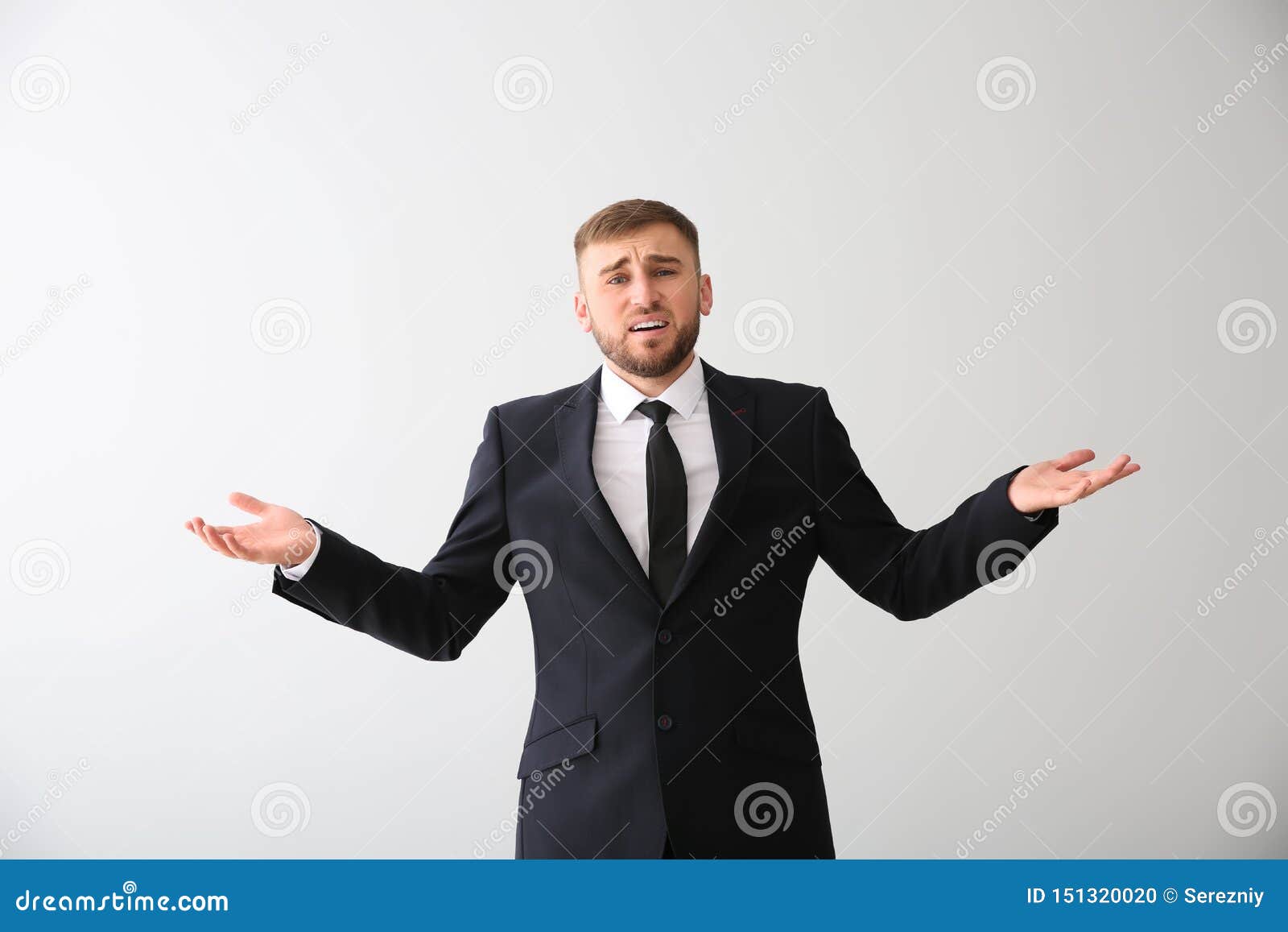 Emotional Young Businessman after Making Mistake on White Background ...
