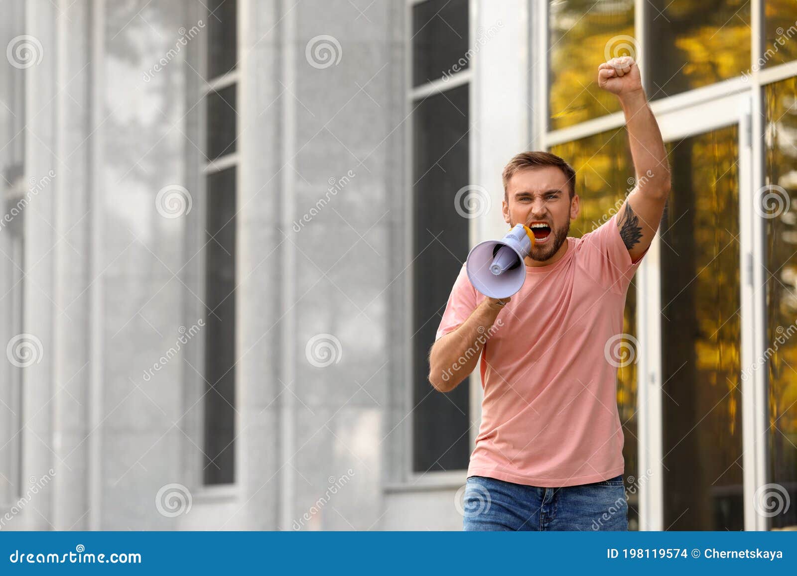 Emotional Young Man with Megaphone Outdoors. Protest Leader Stock Photo ... Emotional Young Man with Megaphone Outdoors. Protest Leader Stock Photo ...