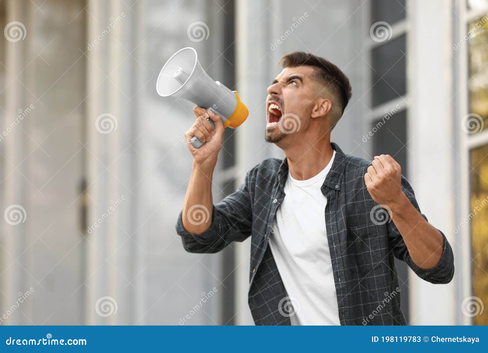 Emotional Young Man with Megaphone. Protest Leader Stock Image - Image ... Emotional Young Man with Megaphone. Protest Leader Stock Image - Image ...