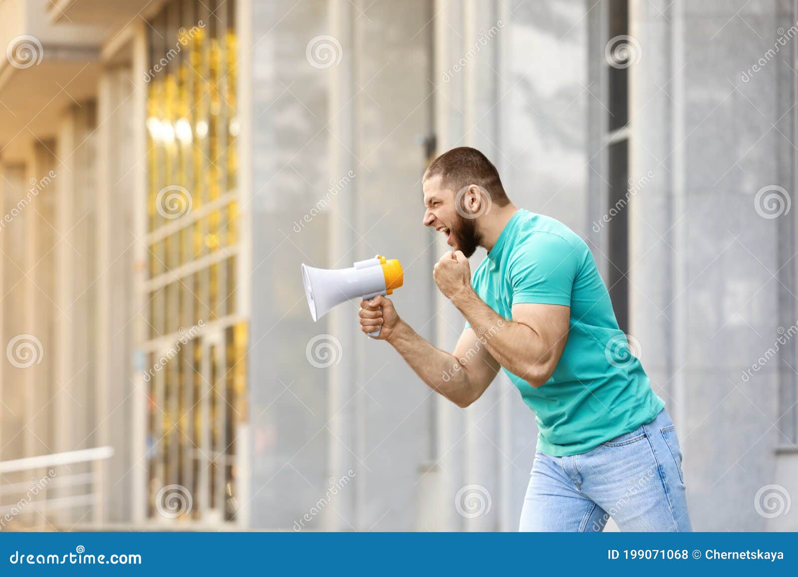 Emotional Young Man with Megaphone. Protest Leader Stock Photo - Image ... Emotional Young Man with Megaphone. Protest Leader Stock Photo - Image ...