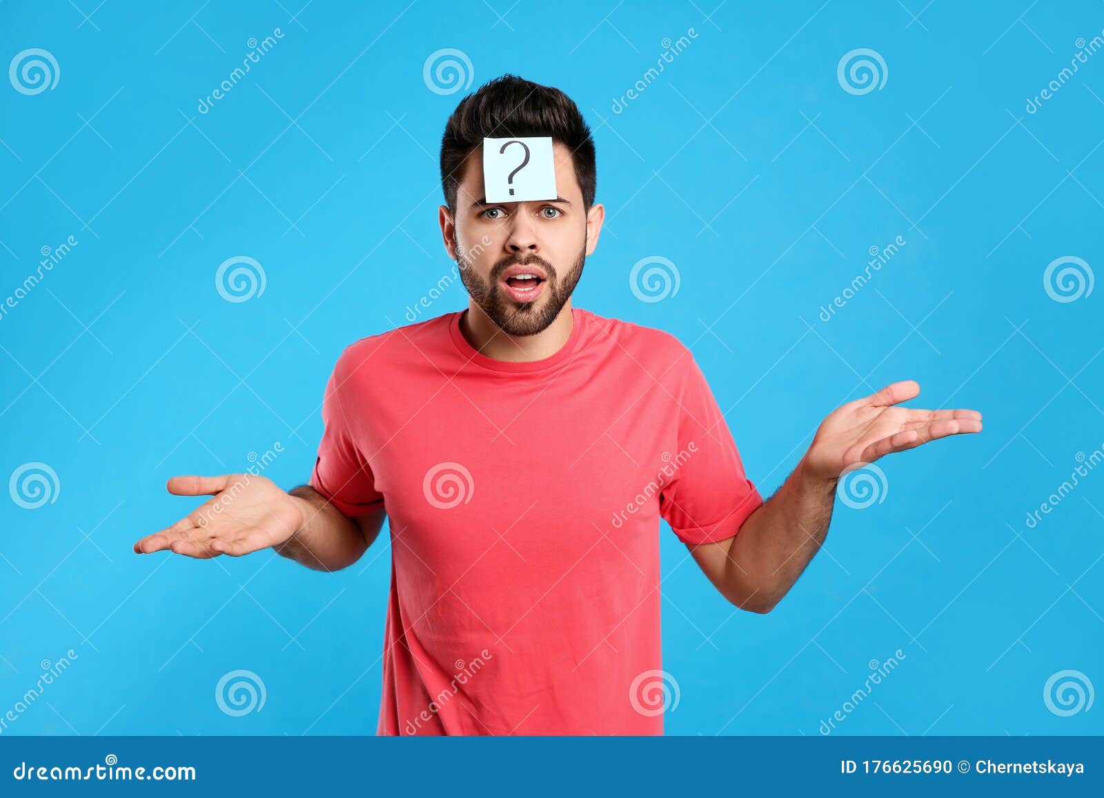 Emotional Young Man with Question Mark Sticker on Forehead Against Blue ...