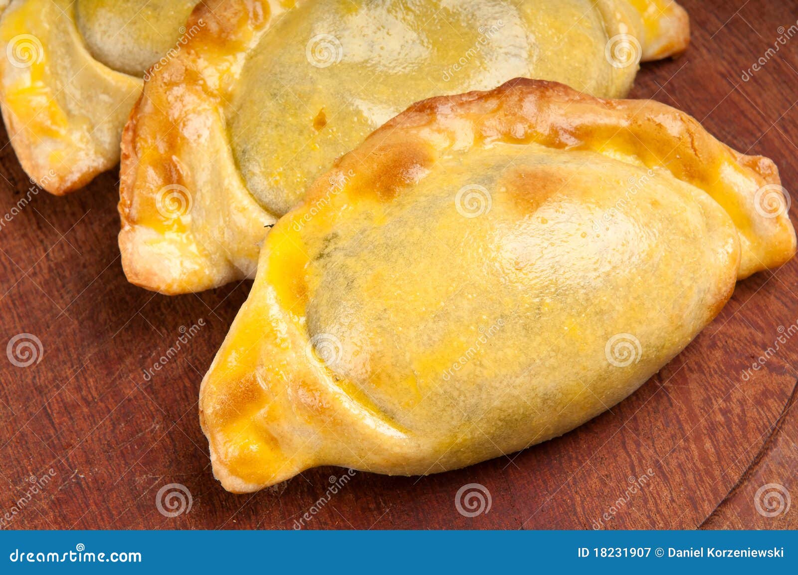 Empanadas over wood table stock image. Image of closeup - 18231907