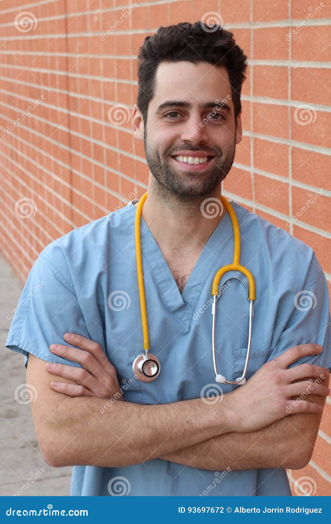 Empathetic Doctor Smiling Close Up Stock Photo - Image of crossed ...
