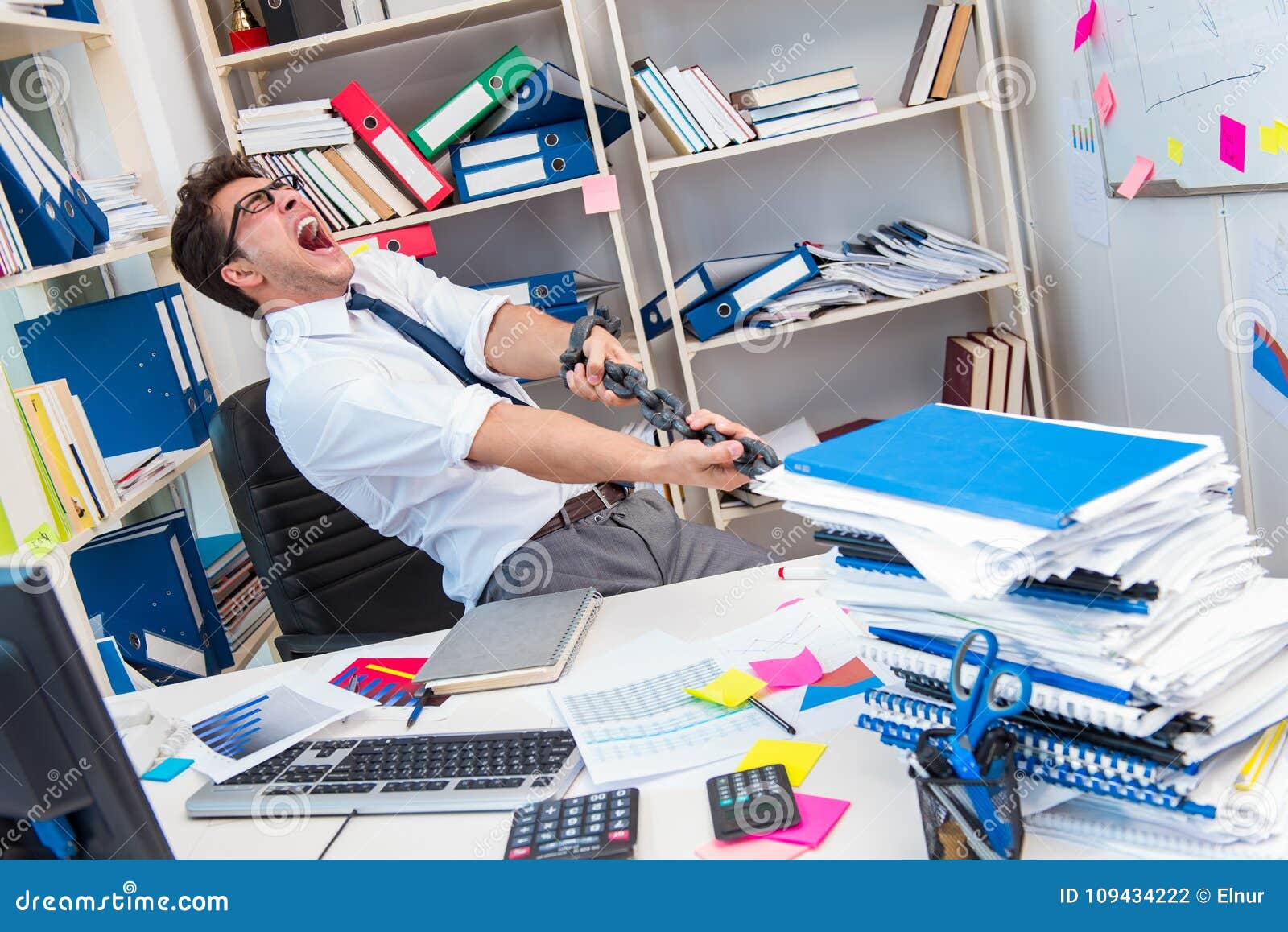 The Employee Attached And Chained To His Desk With Chain Stock Photo ...