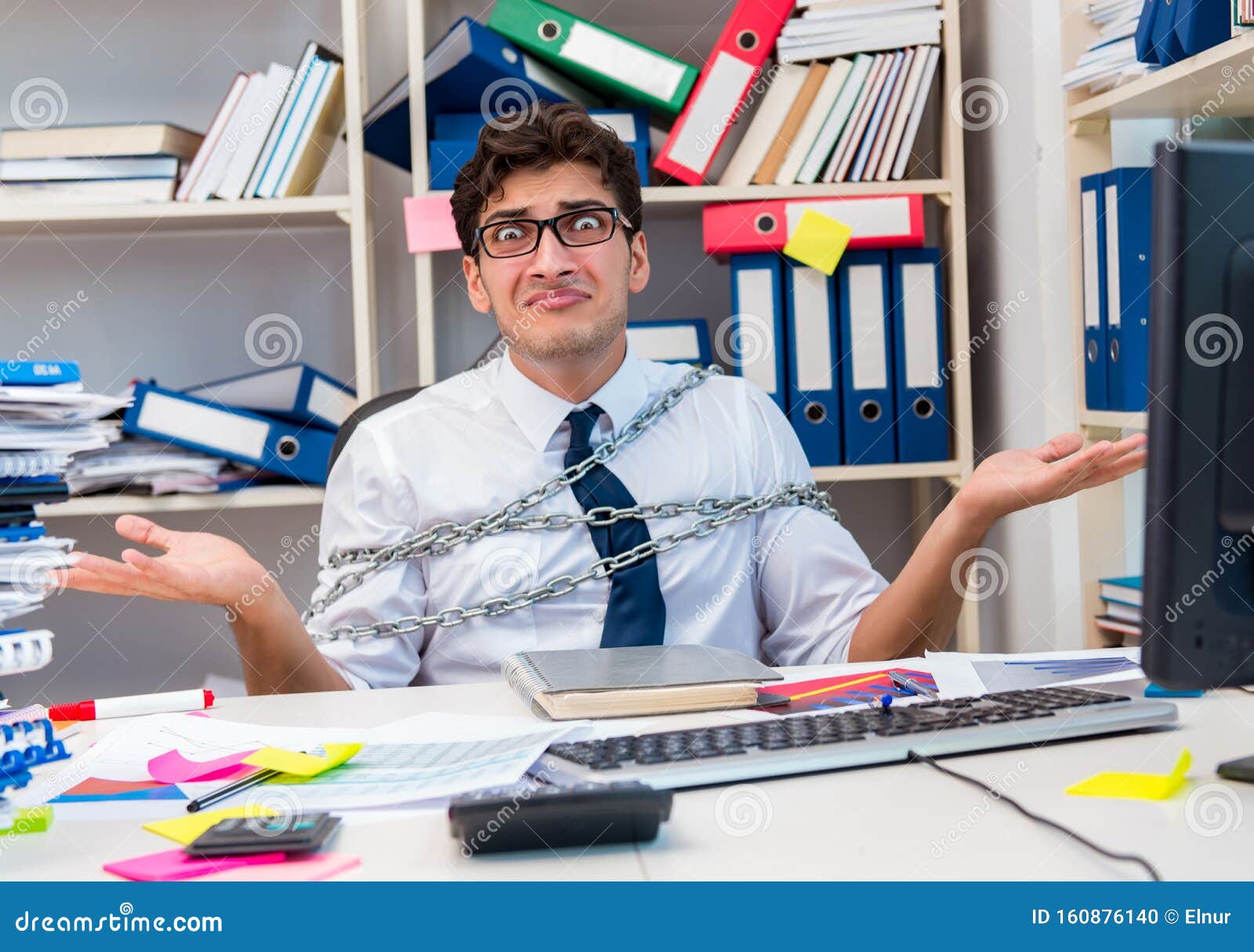 Employee Attached and Chained To His Desk with Chain Stock Photo ...