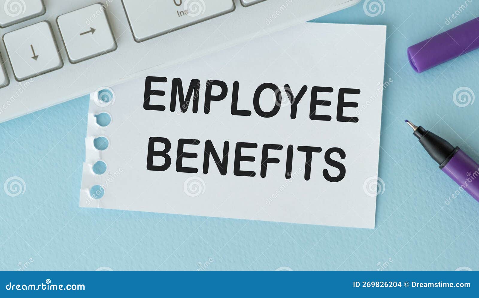 EMPLOYEE BENEFITS Text on a Notebook with Keyboard , Pen Glasses on ...