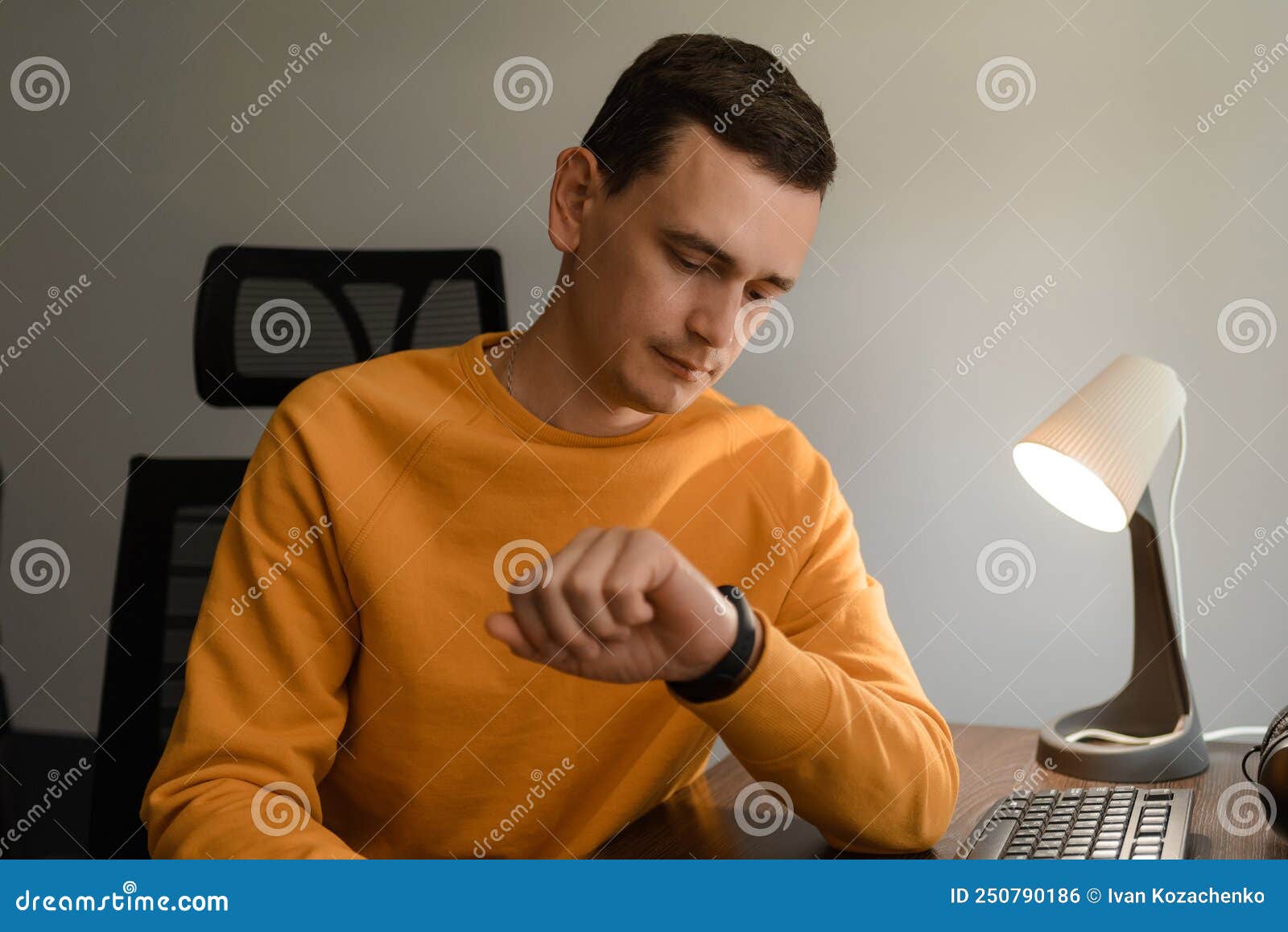 An Employee is Checking How Much Time is Left To Complete the Task ...