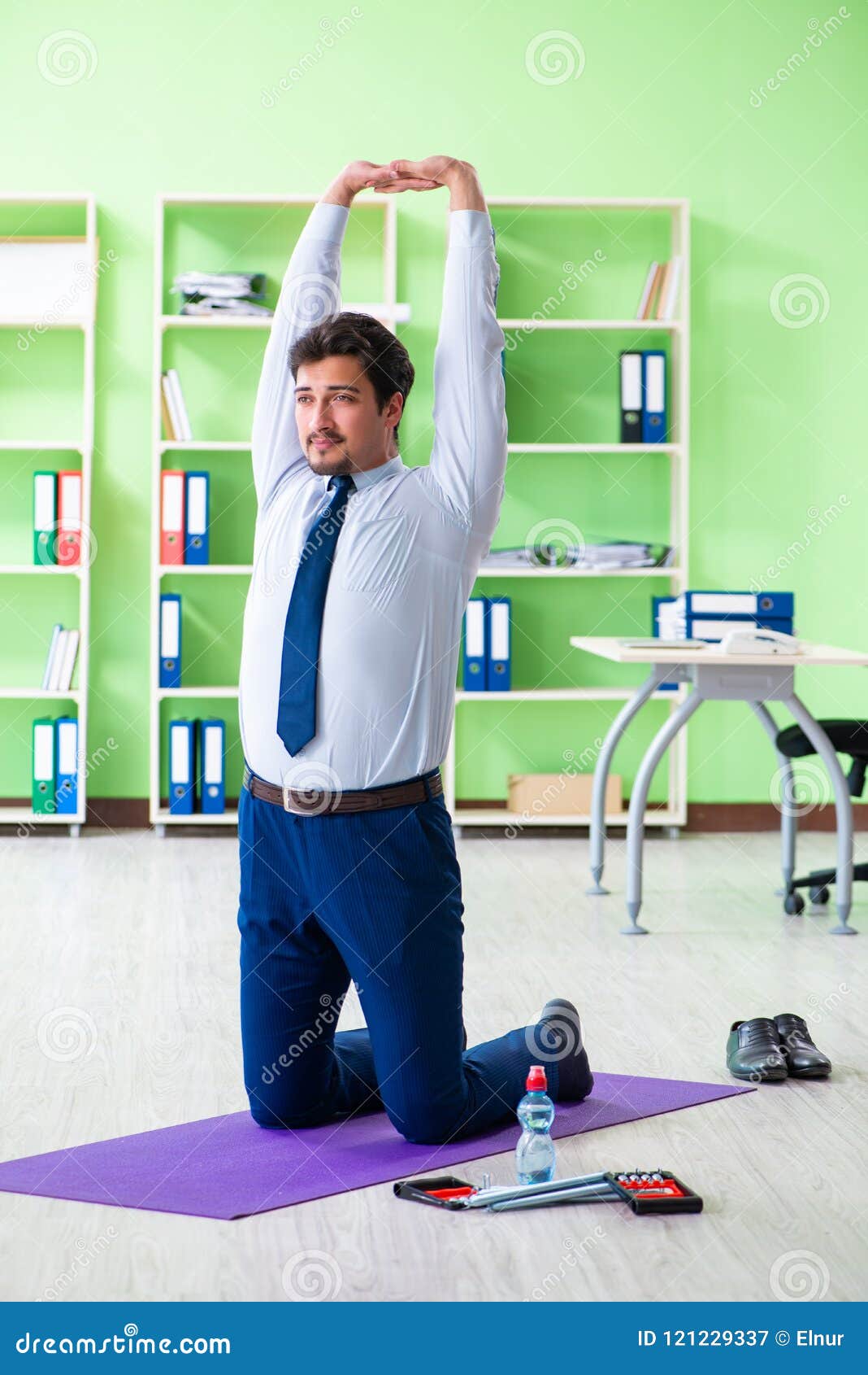 The Employee Doing Exercises during Break at Work Stock Image - Image ...