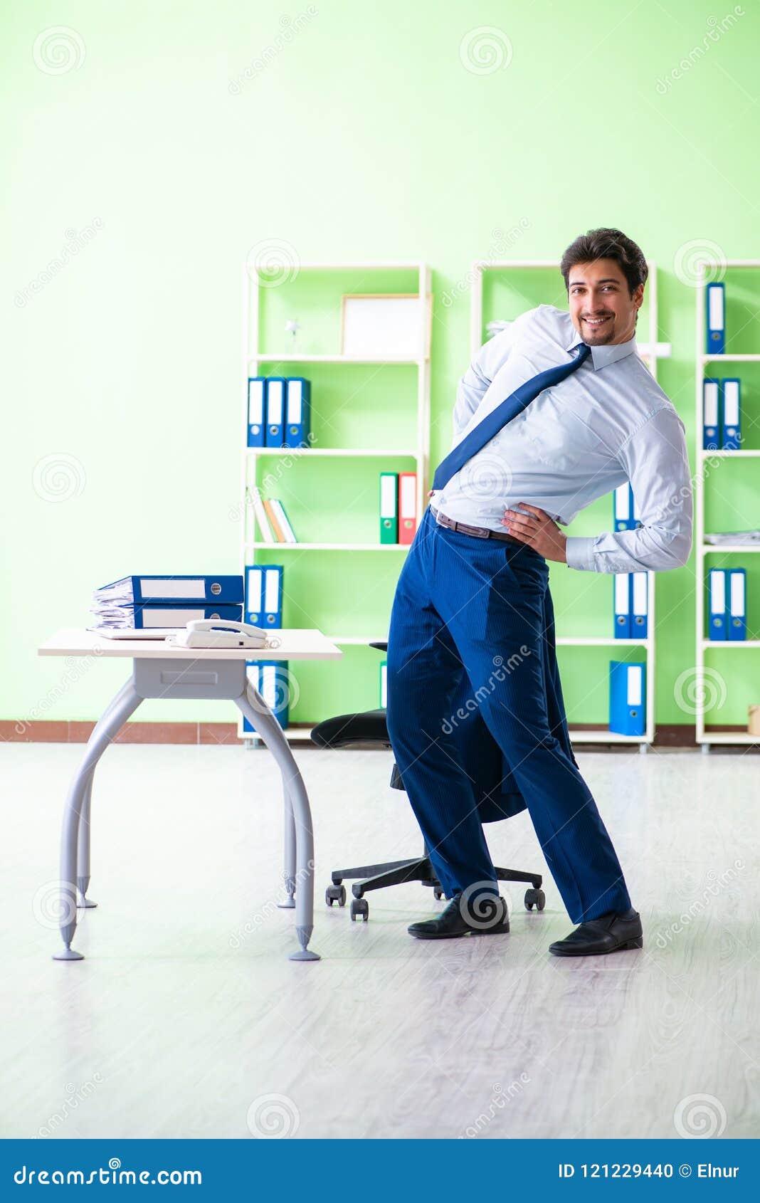 The Employee Doing Exercises during Break at Work Stock Photo - Image ...