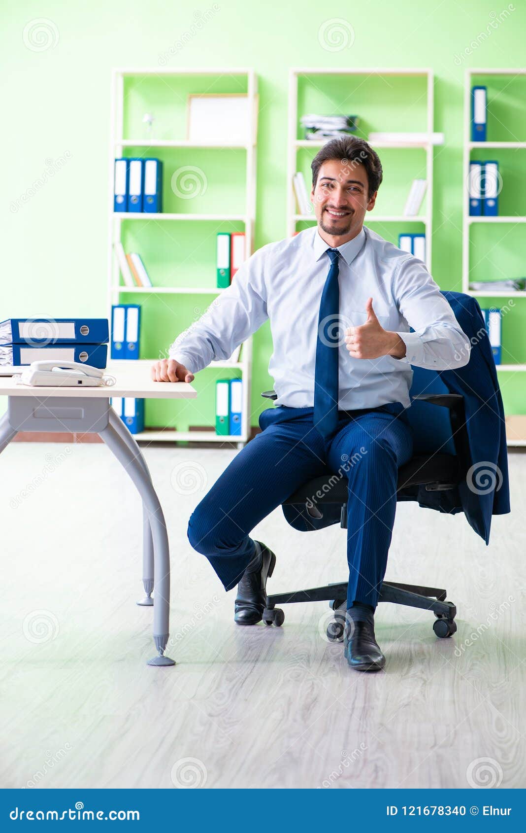 The Employee Doing Exercises during Break at Work Stock Photo - Image ...