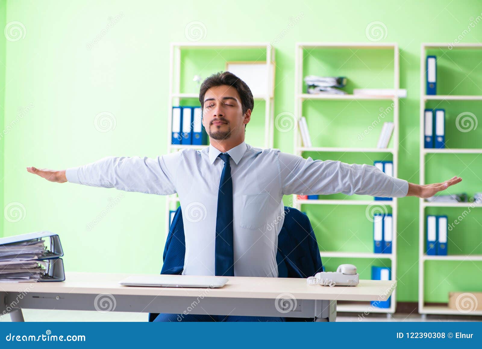 The Employee Doing Exercises during Break at Work Stock Photo - Image ...