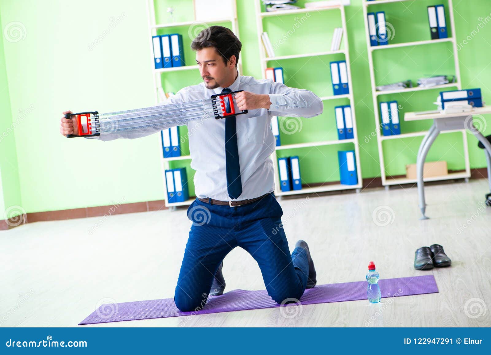 The Employee Doing Exercises during Break at Work Stock Image - Image ...
