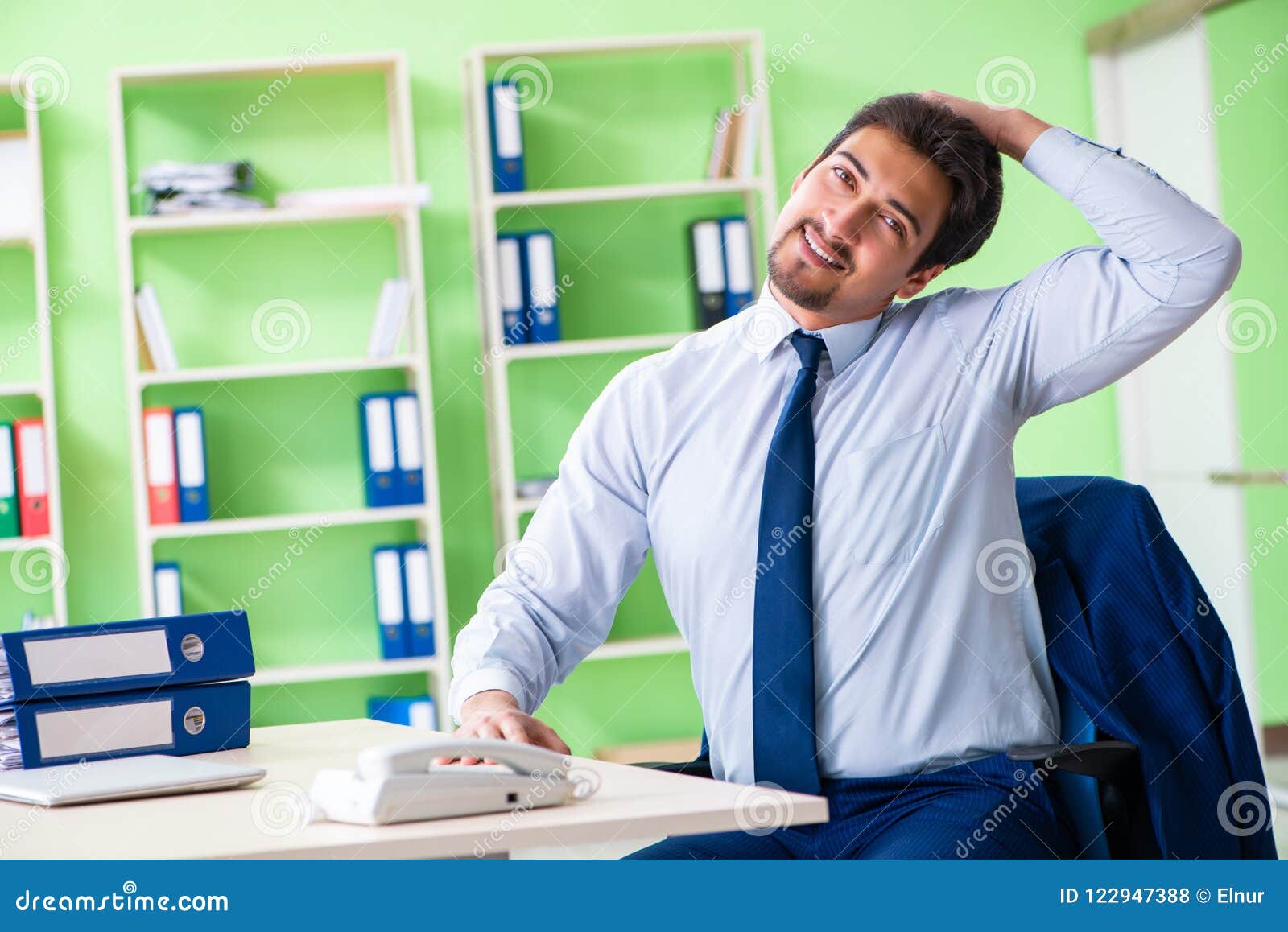 The Employee Doing Exercises during Break at Work Stock Photo - Image ...