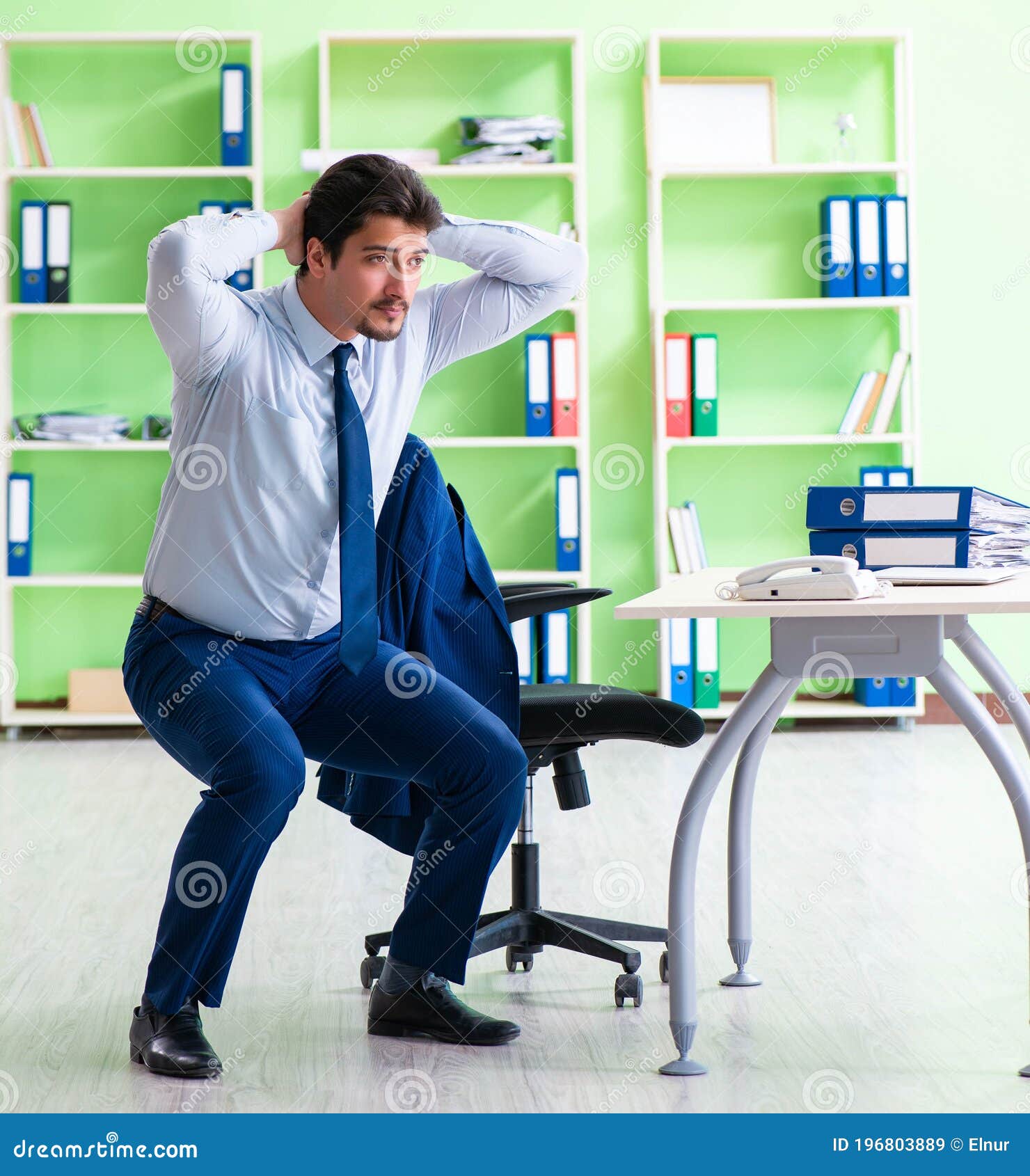 Employee Doing Exercises during Break at Work Stock Image - Image of ...