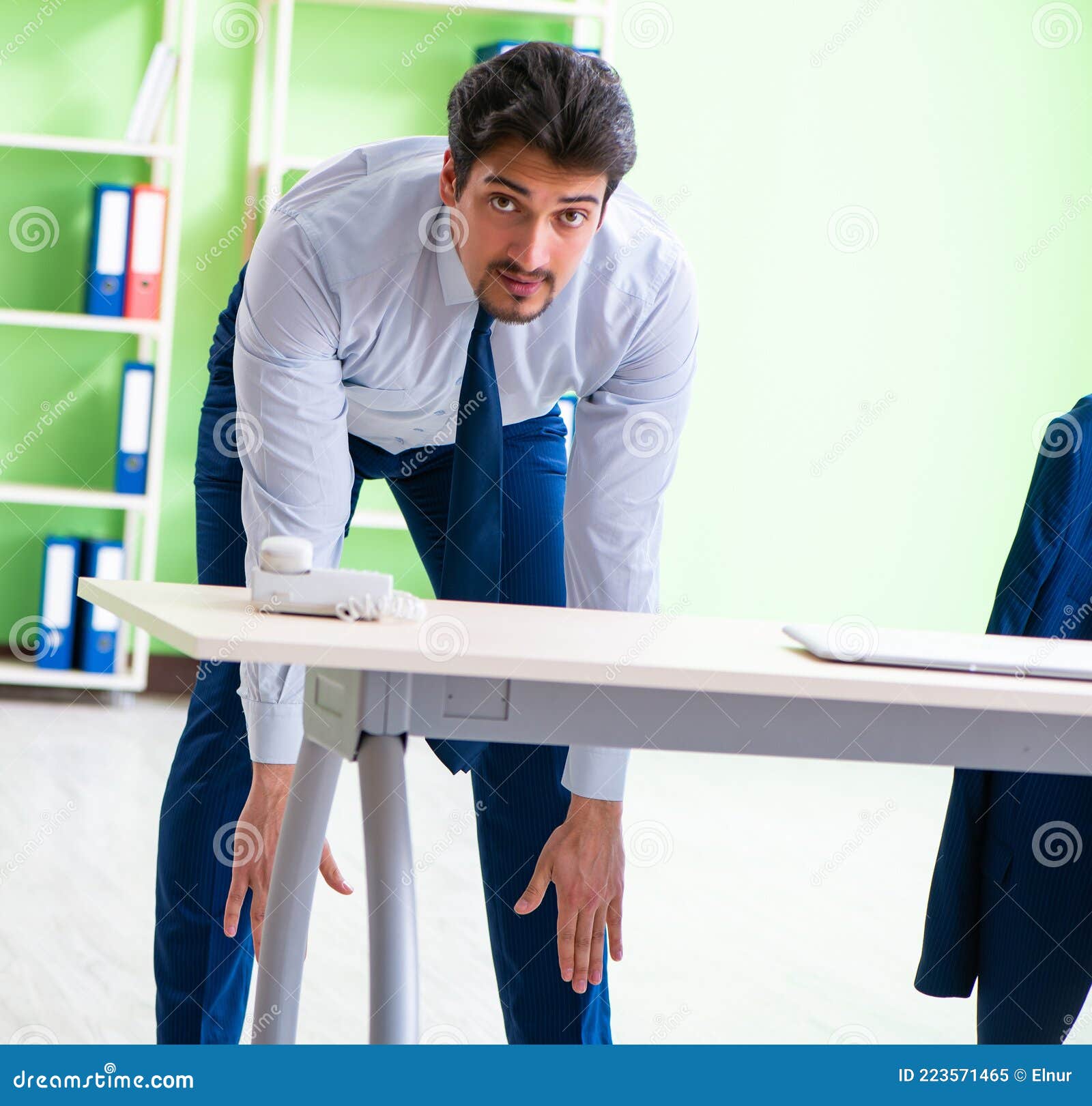 Employee Doing Exercises during Break at Work Stock Image - Image of ...