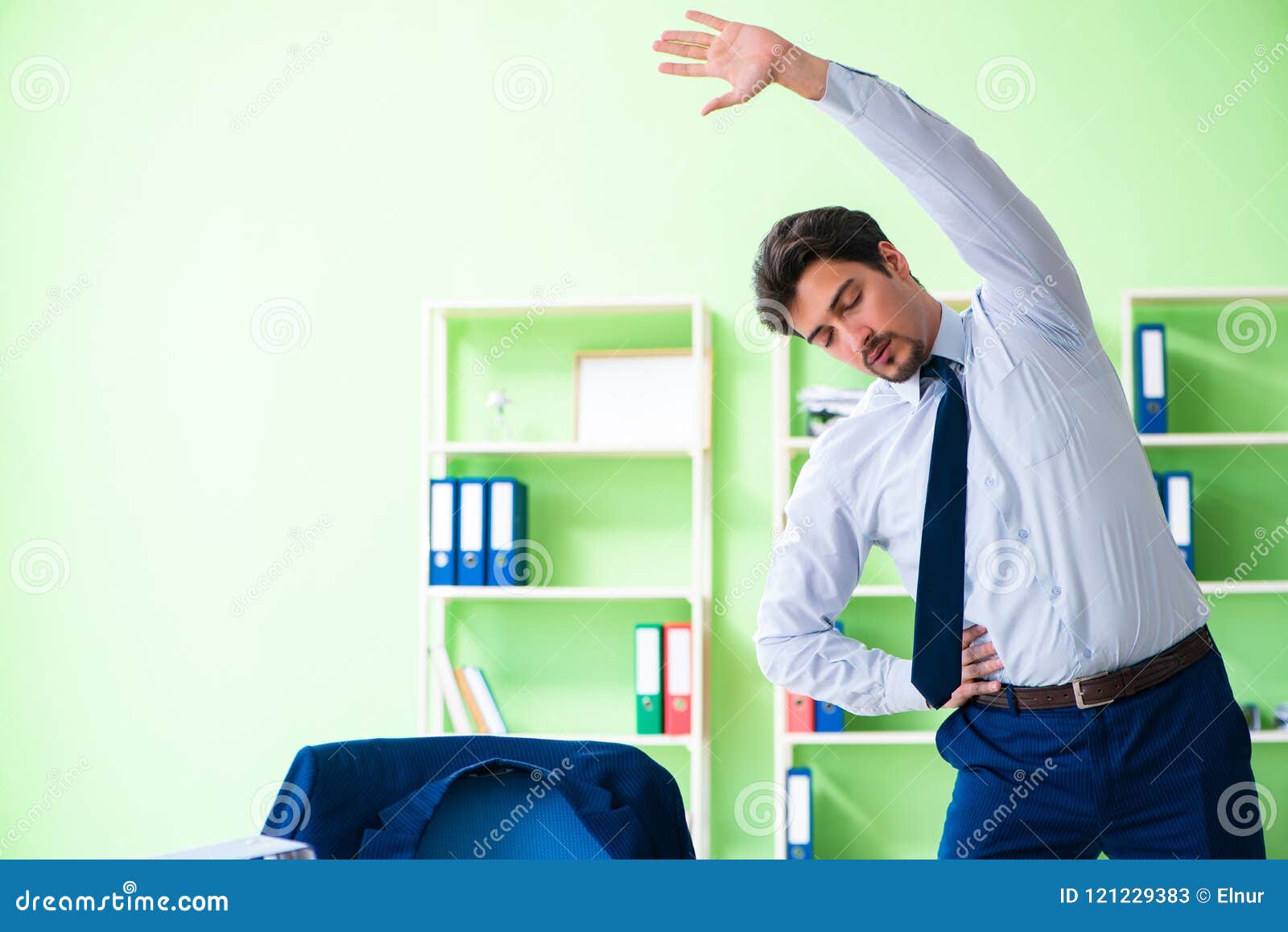 The Employee Doing Exercises during Break at Work Stock Image - Image ...