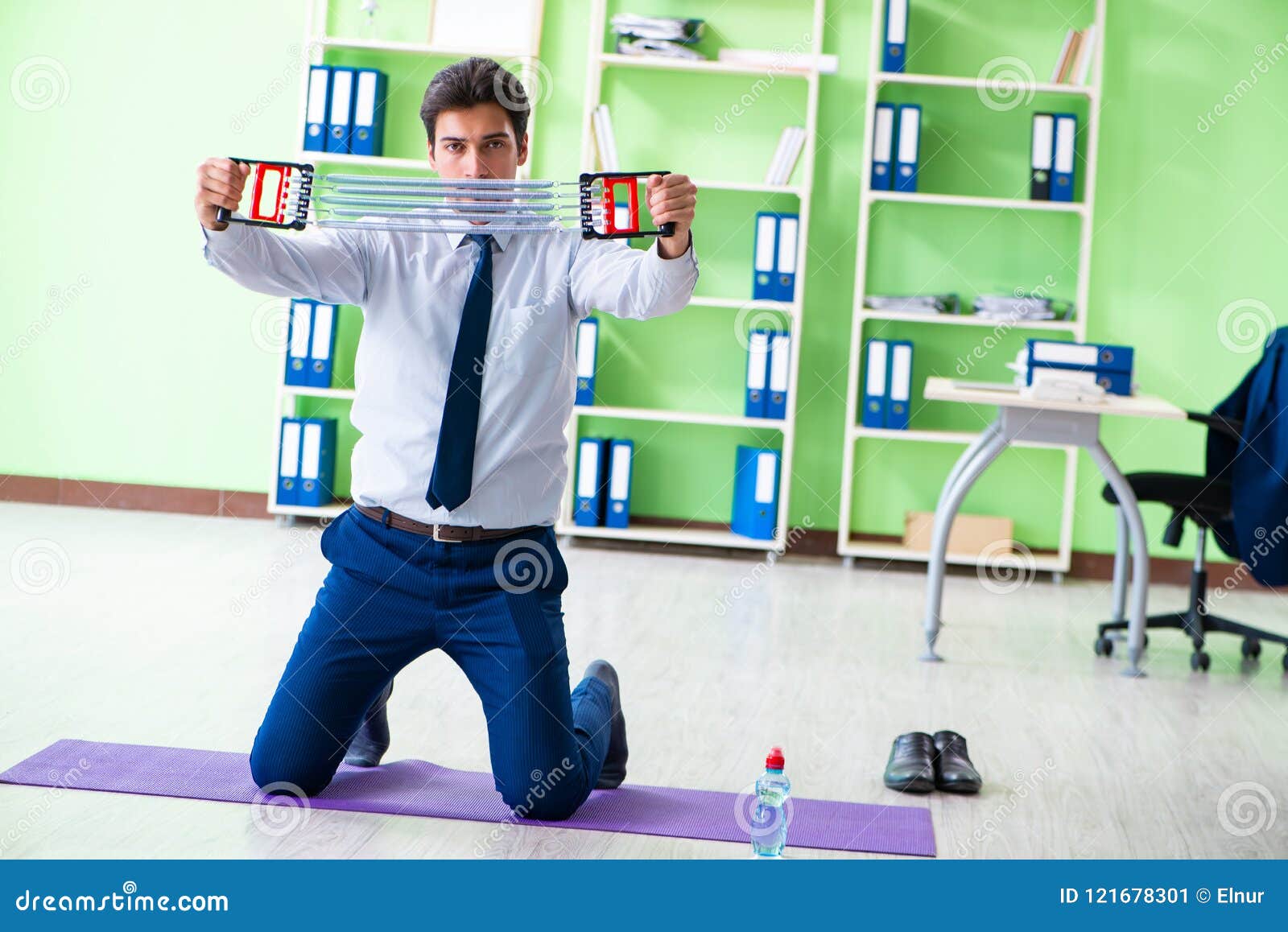 The Employee Doing Exercises during Break at Work Stock Image - Image ...