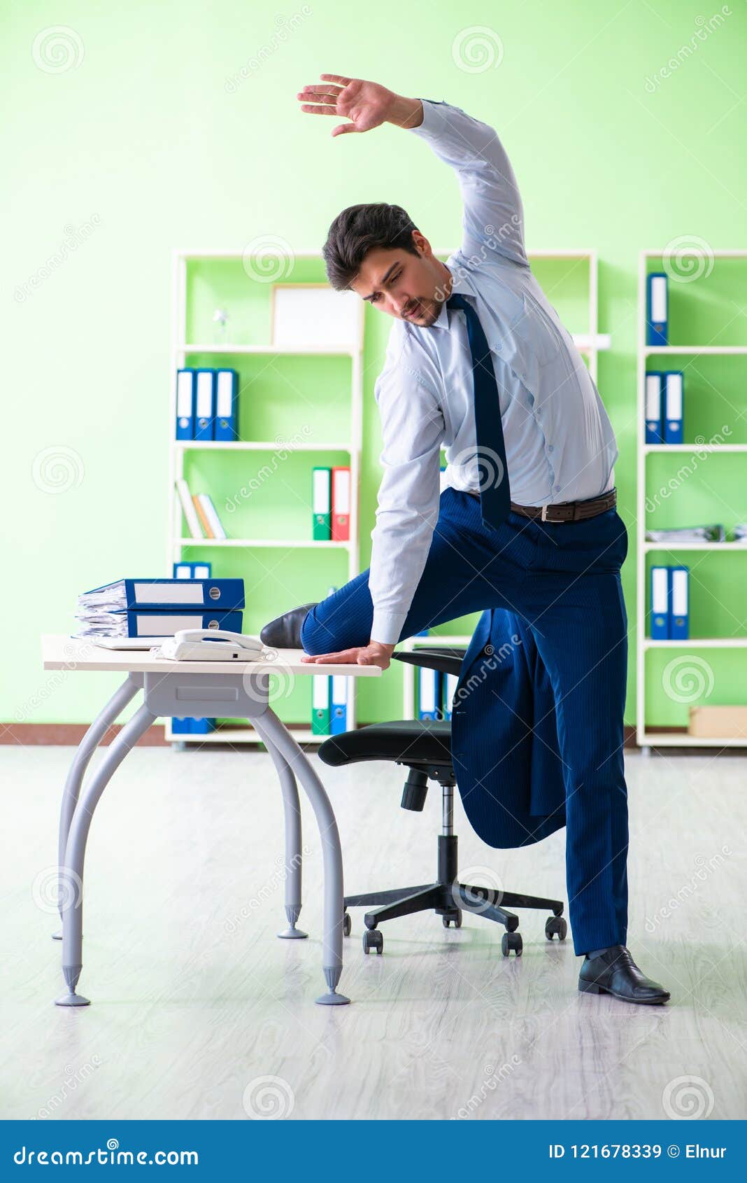 The Employee Doing Exercises during Break at Work Stock Image - Image ...