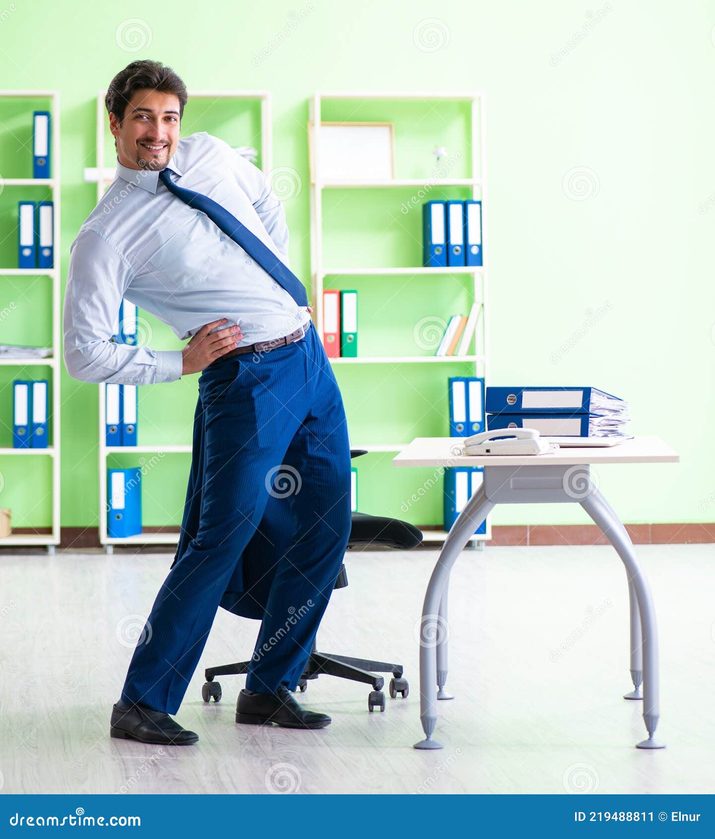 Employee Doing Exercises during Break at Work Stock Image - Image of ...