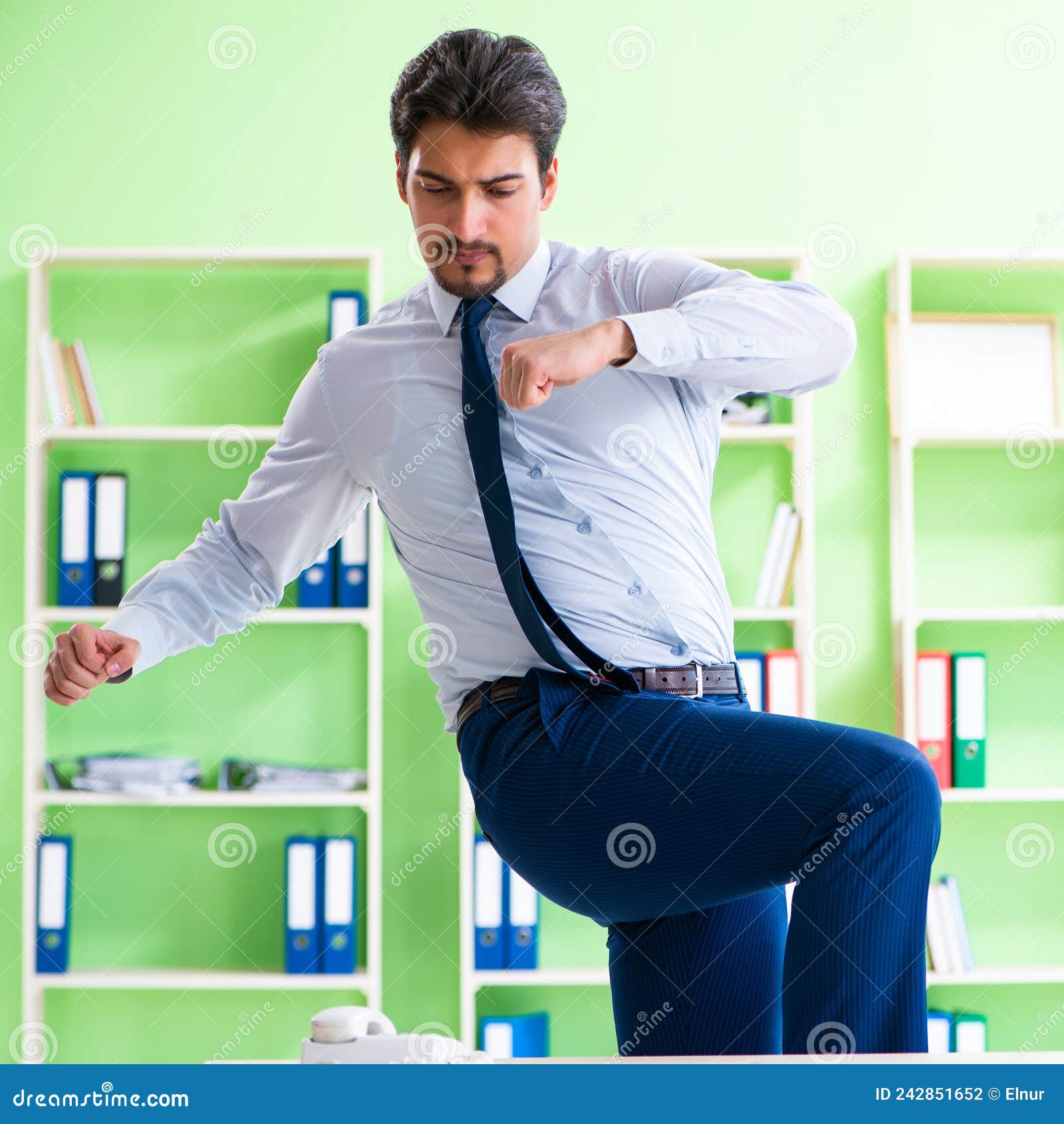 Employee Doing Exercises during Break at Work Stock Photo - Image of ...