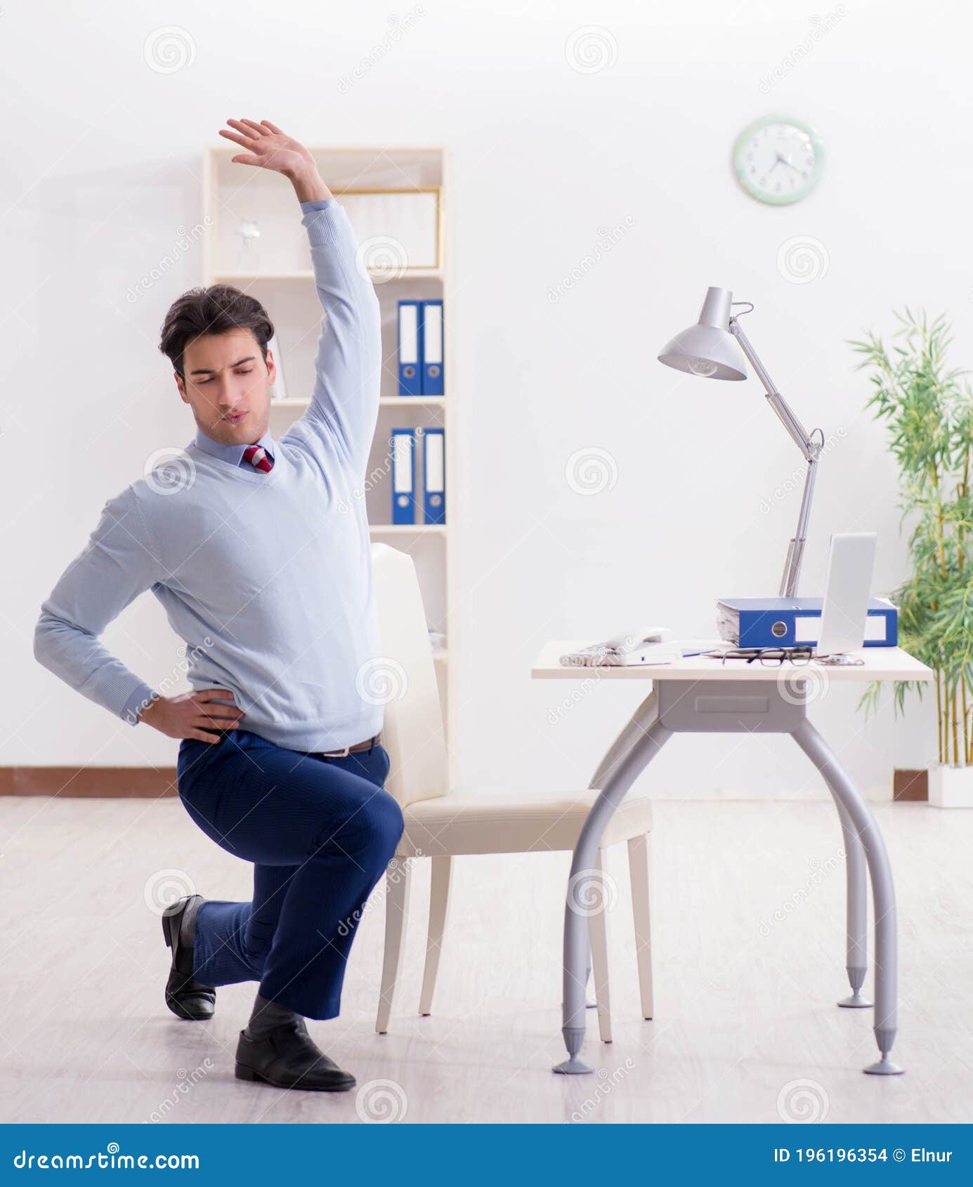 Employee Doing Stretching Exercises in the Office Stock Photo - Image ...