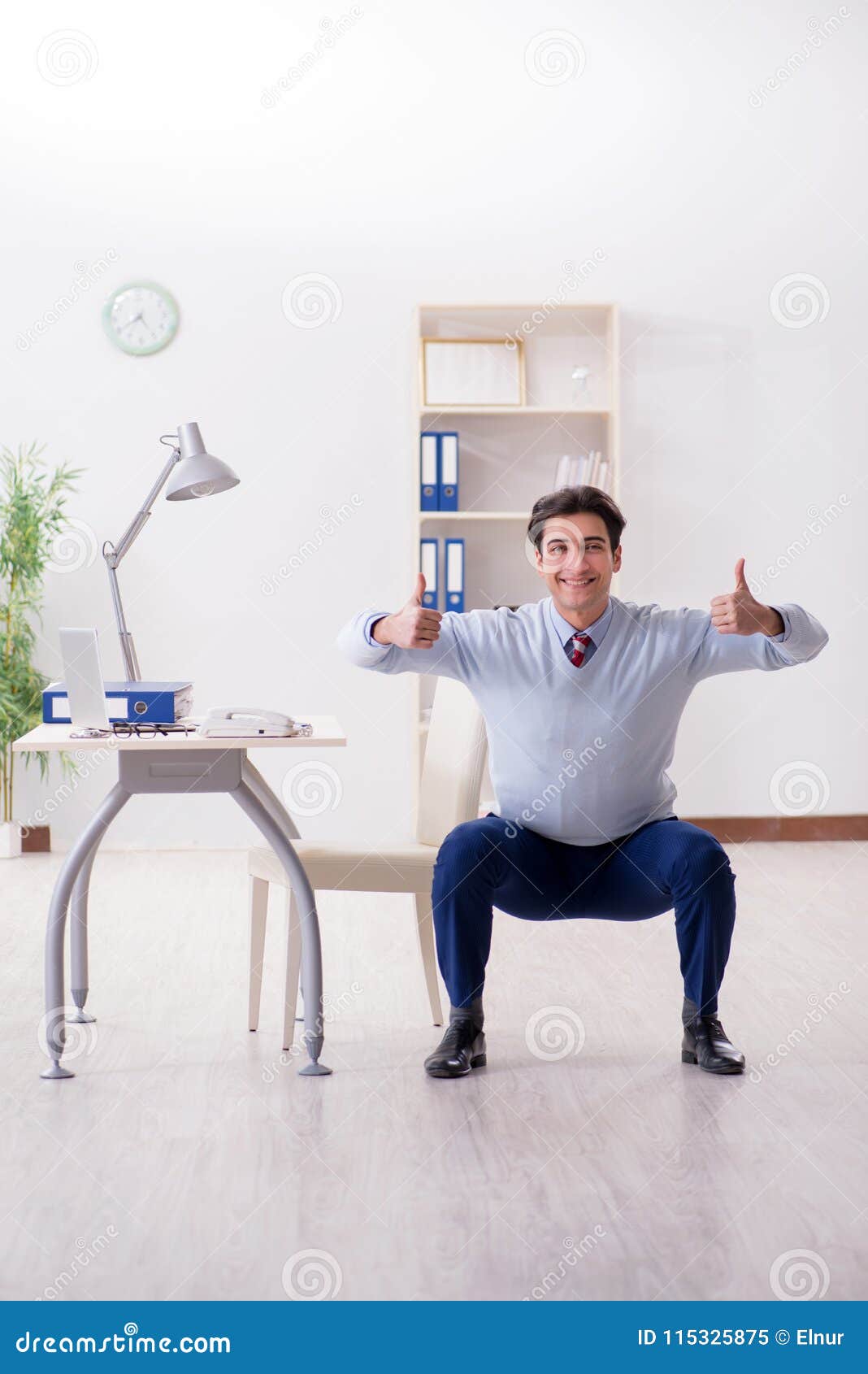 The Employee Doing Stretching Exercises in the Office Stock Image ...