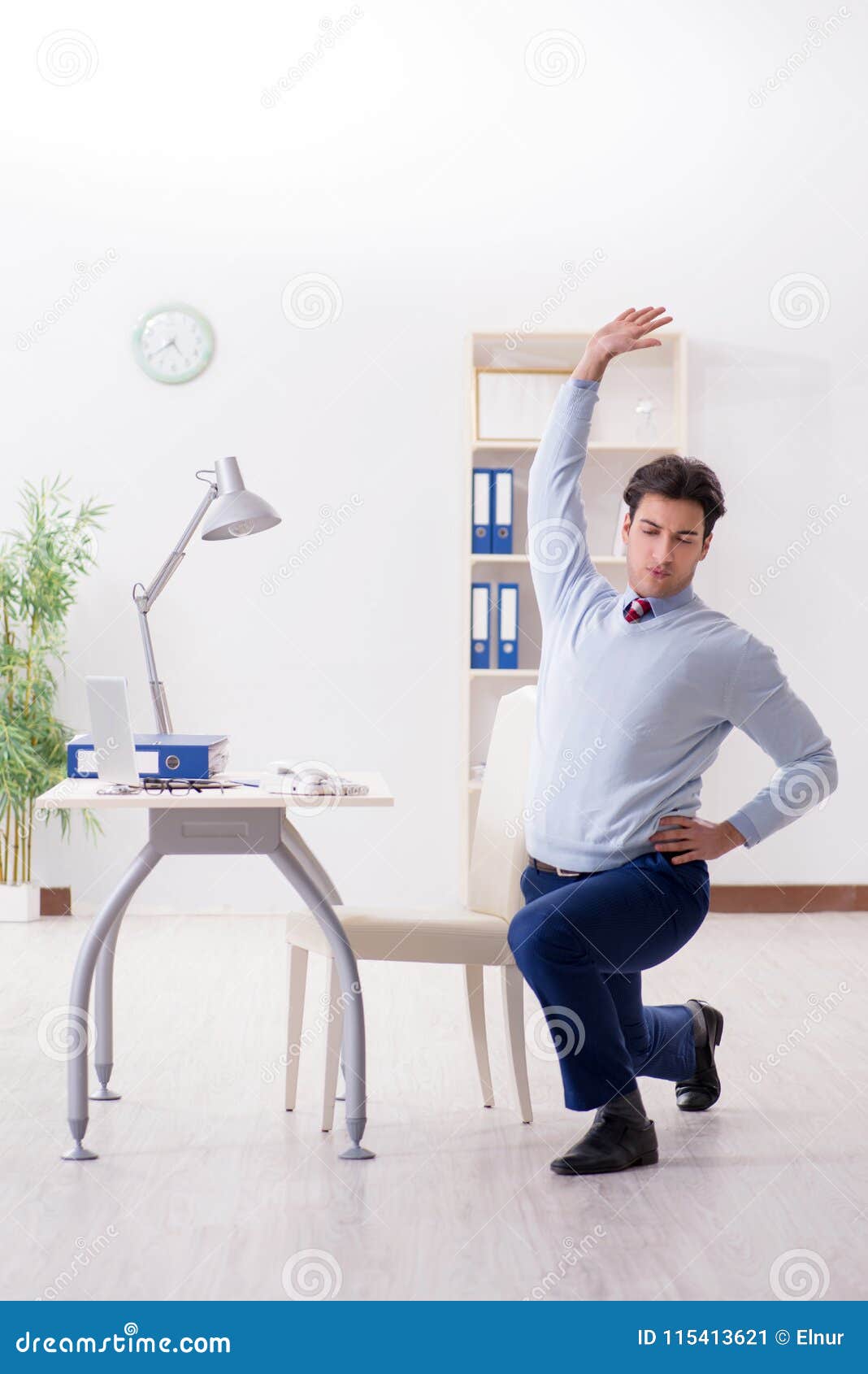 The Employee Doing Stretching Exercises in the Office Stock Image ...
