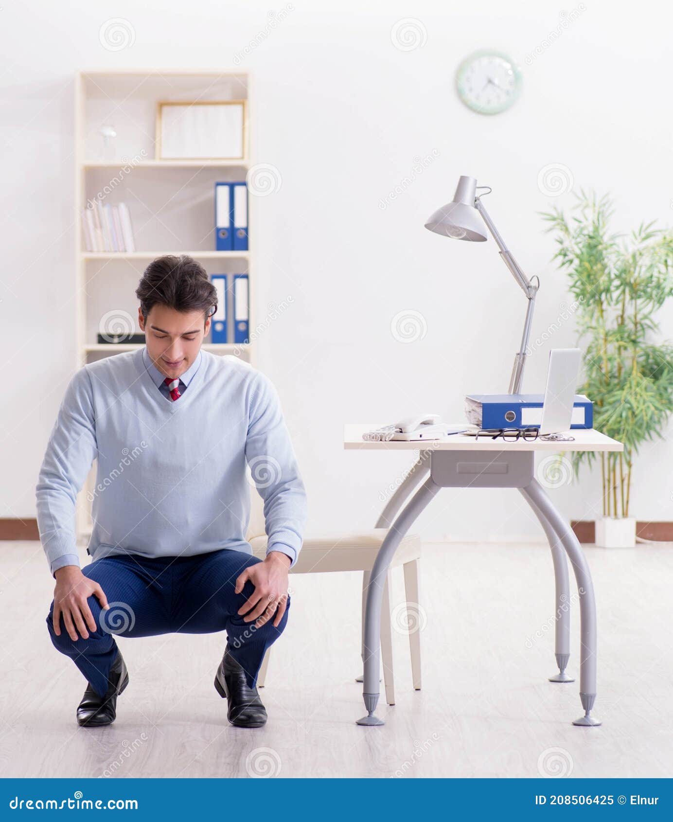 Employee Doing Stretching Exercises in the Office Stock Image - Image ...