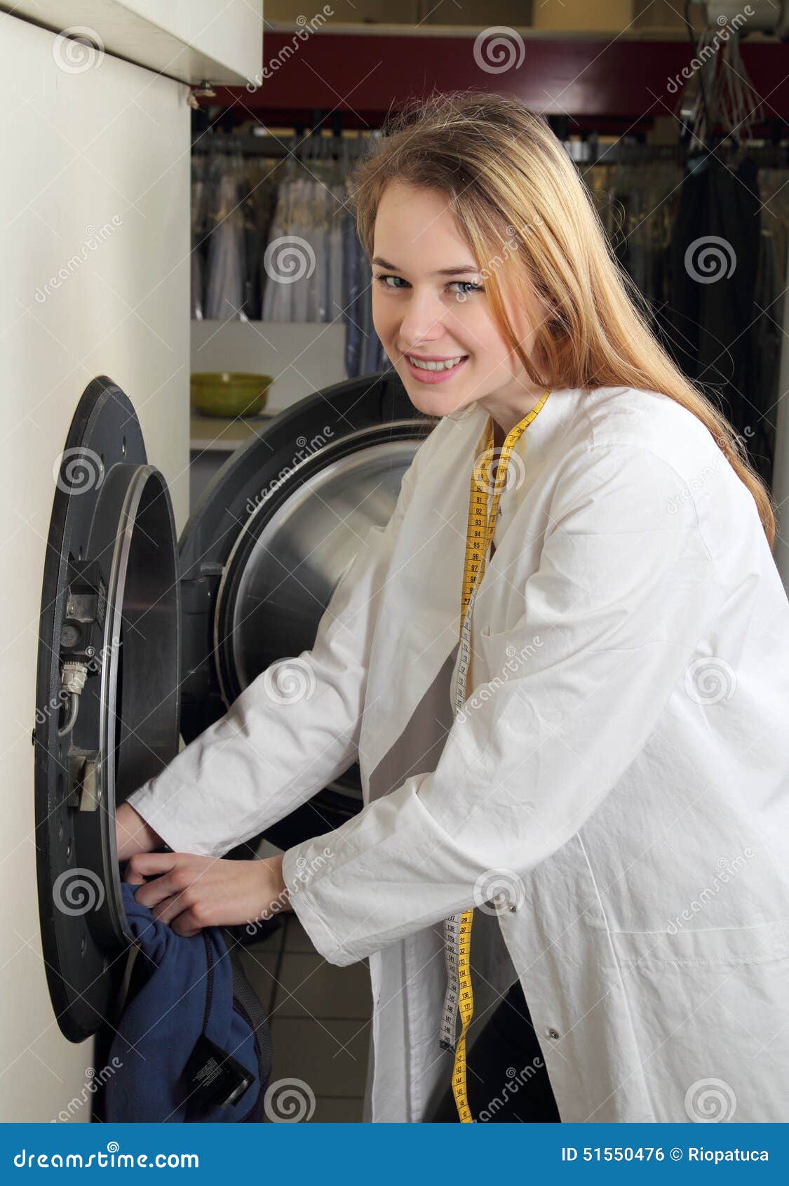 Employee of Dry Cleaning Loads a Professionial Washing Machine Stock ...