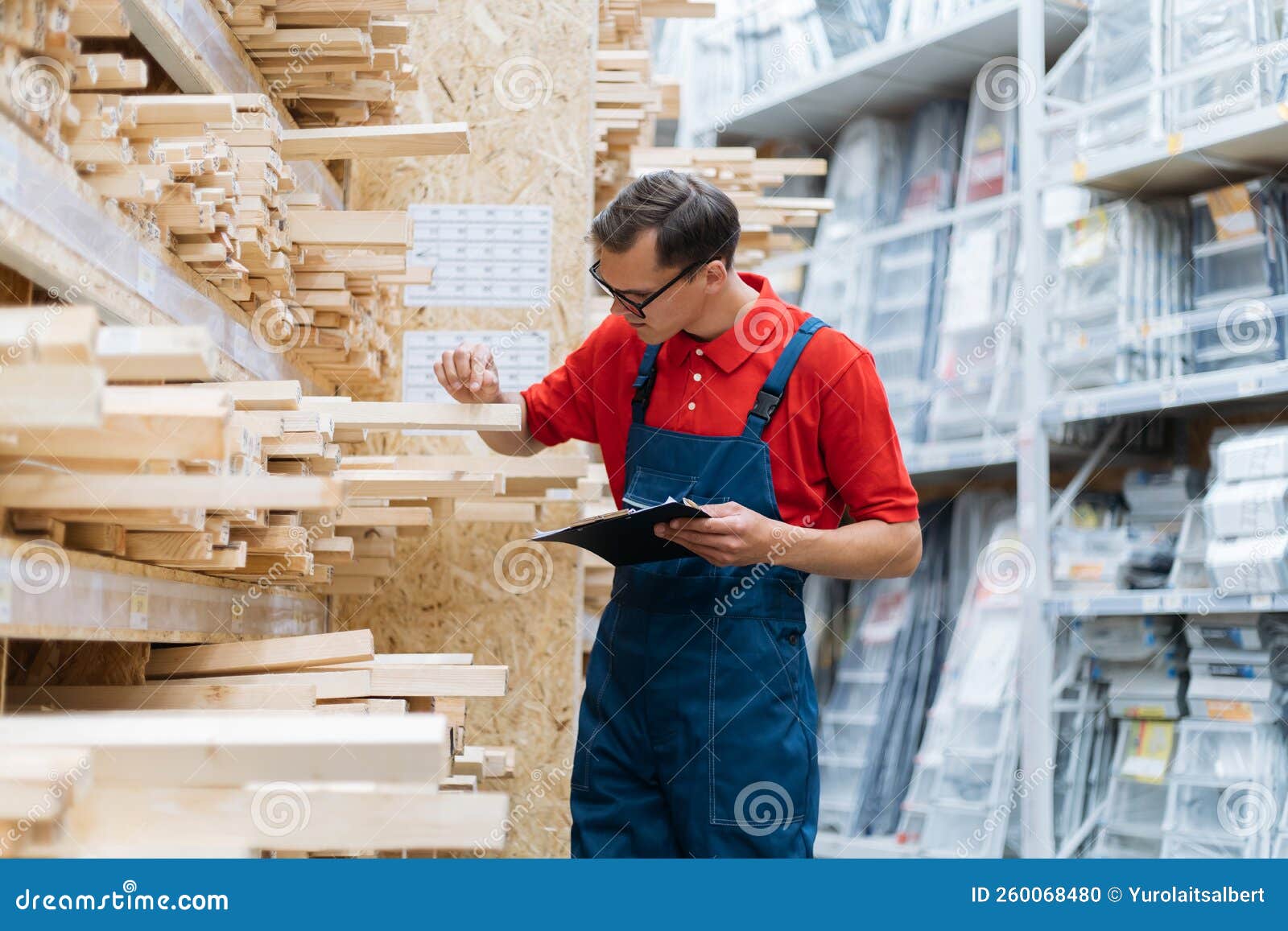 Employee of a Flooring Store Checking the Markings on a Laminated Board ...