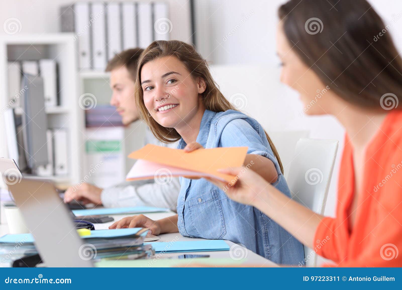 Employee Giving Documents Folder To a Colleague Stock Image - Image of ...