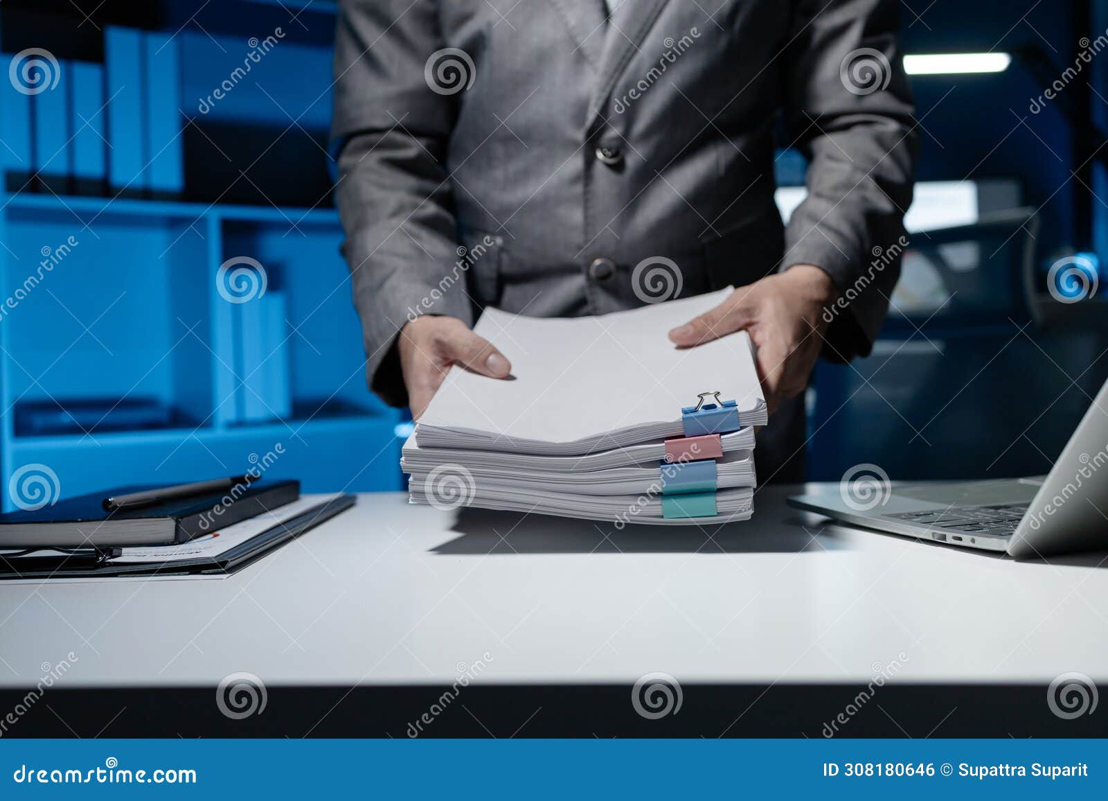 An Employee Held a Large Pile of Documents in His Hand, Large Piles of ...