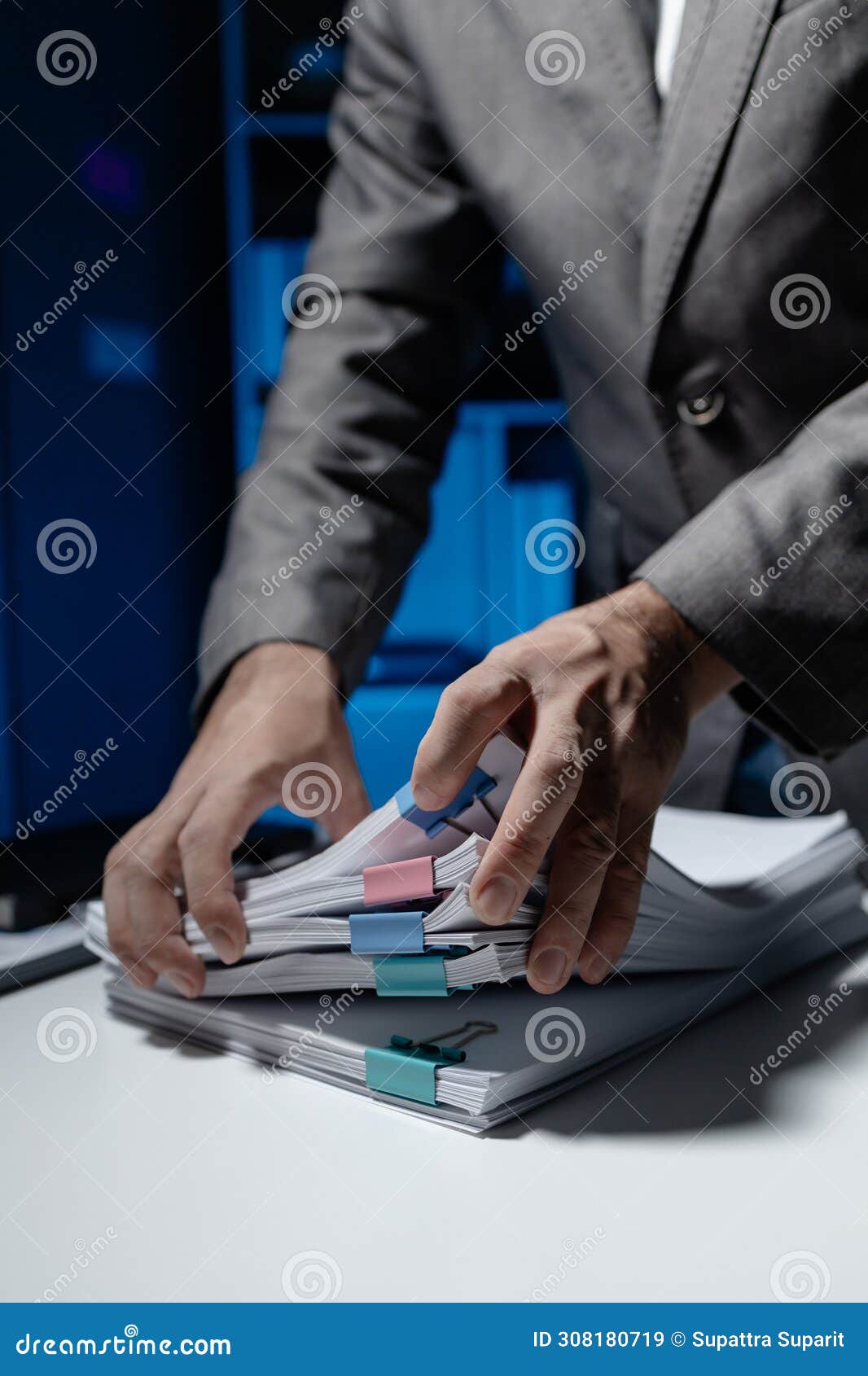 An Employee Held a Large Pile of Documents in His Hand, Large Piles of ...