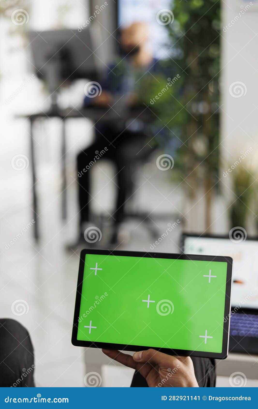 Employee Holding Tablet with Chroma Key Screen while Working Stock ...
