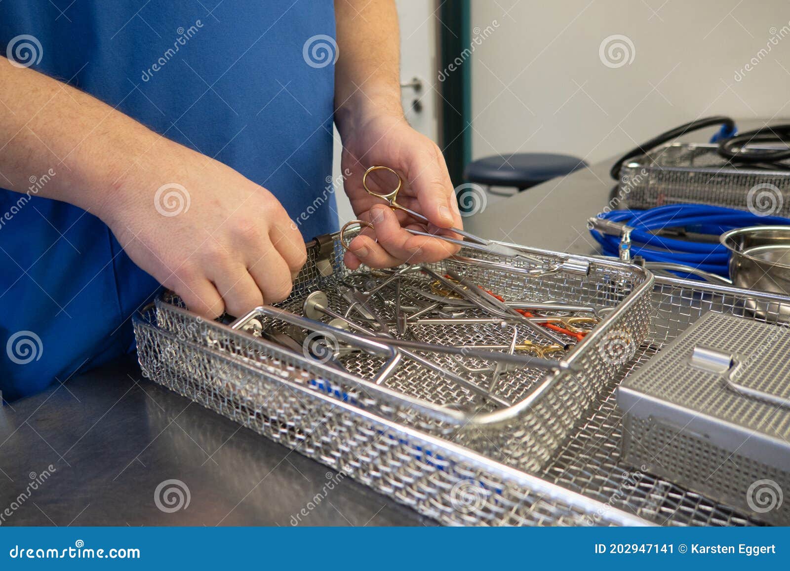 Employee of a Hospital Sterilization Department Sorts the Cleaned ...