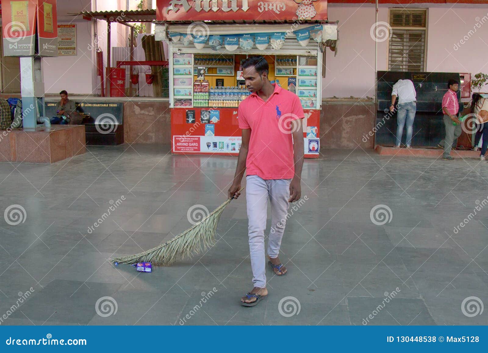 Employee Janitor Sweeping the Passenger Platform. Editorial Stock Photo ...