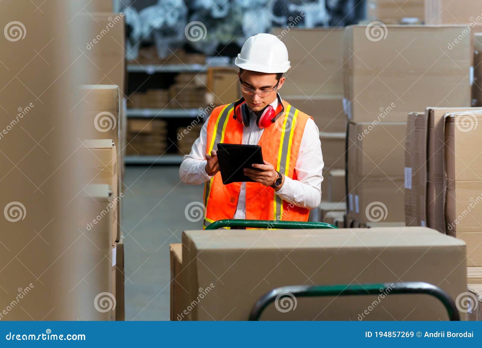 Employee Of A Logistics Warehouse Takes An Inventory Of Goods. Stock ...