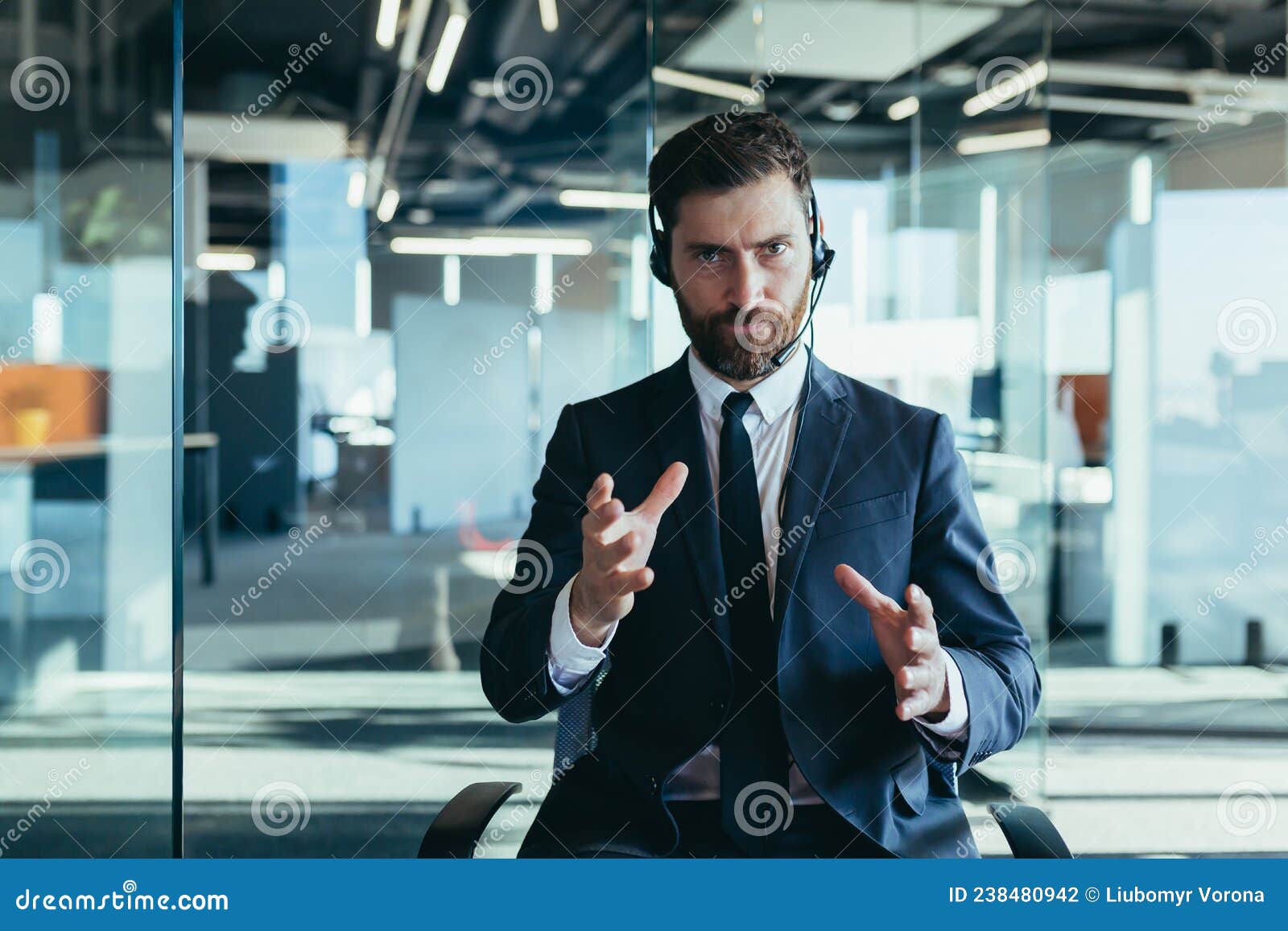 The Employee Makes a Video Call, Looks at the Camera and Explains the ...