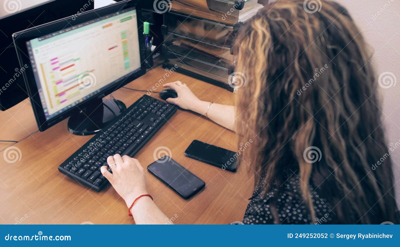 Employee in the Office Working with Spreadsheets at the Computer Stock ...