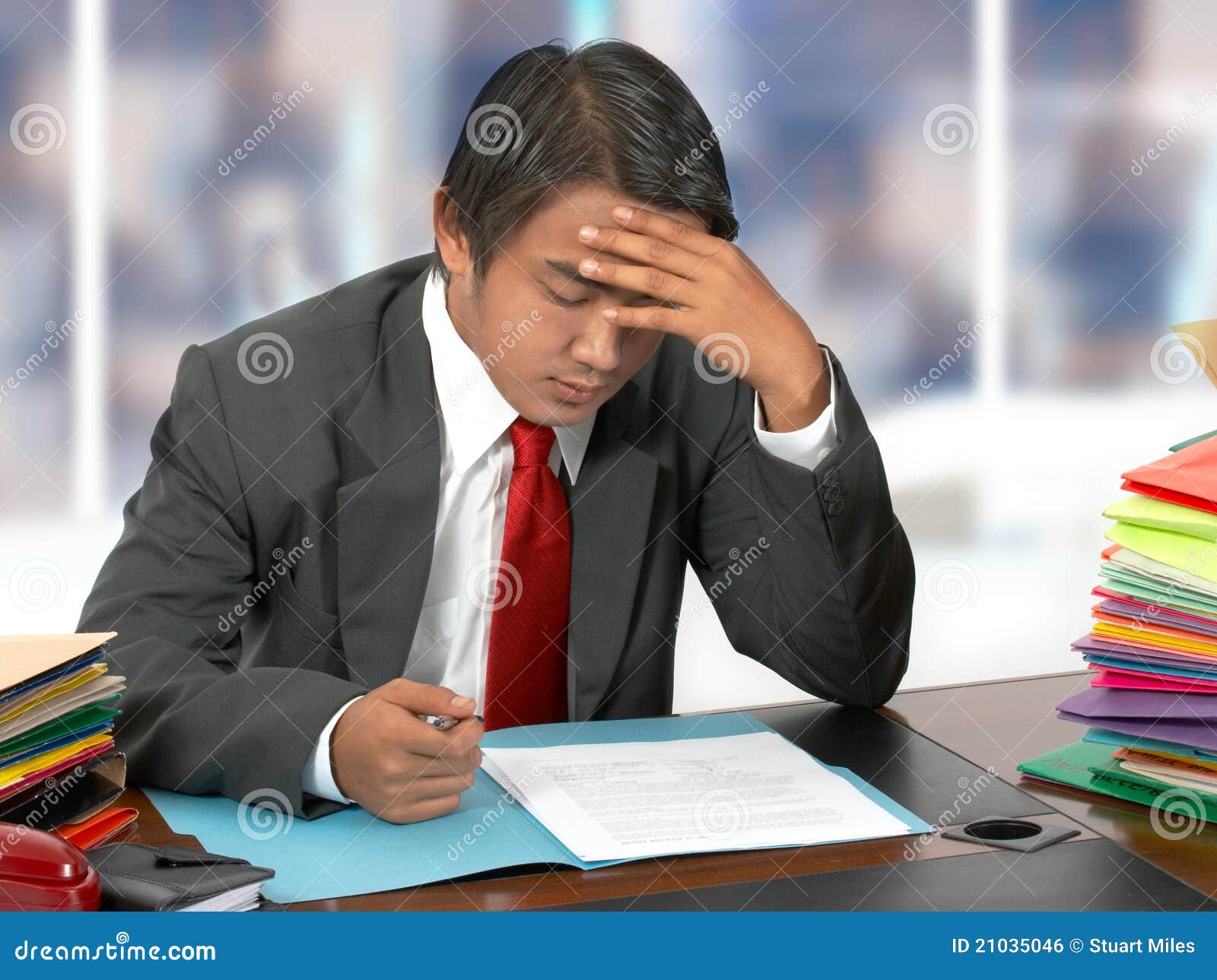 Employee Reading Documents at His Desk Stock Photo - Image of blind ...