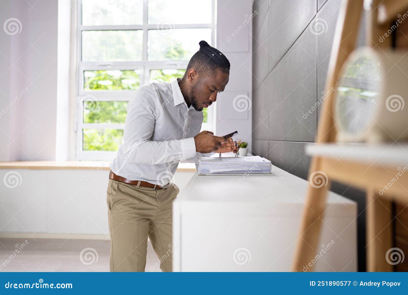 Employee Stealing Documents in Office Using Phone Stock Image - Image ...